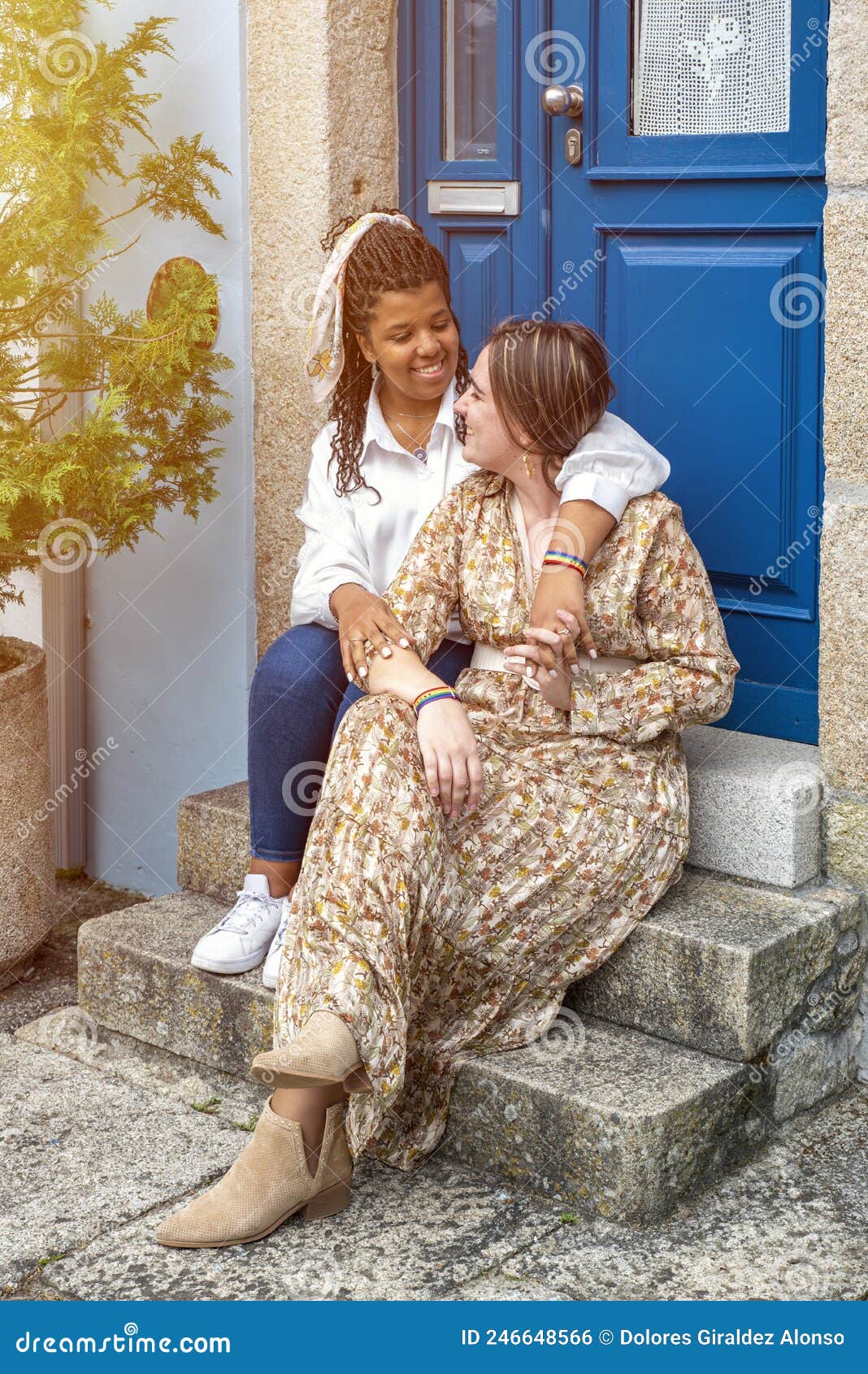 Multiracial Lesbian Couple With Lgtb Symbol Rainbow Bracelets Stock