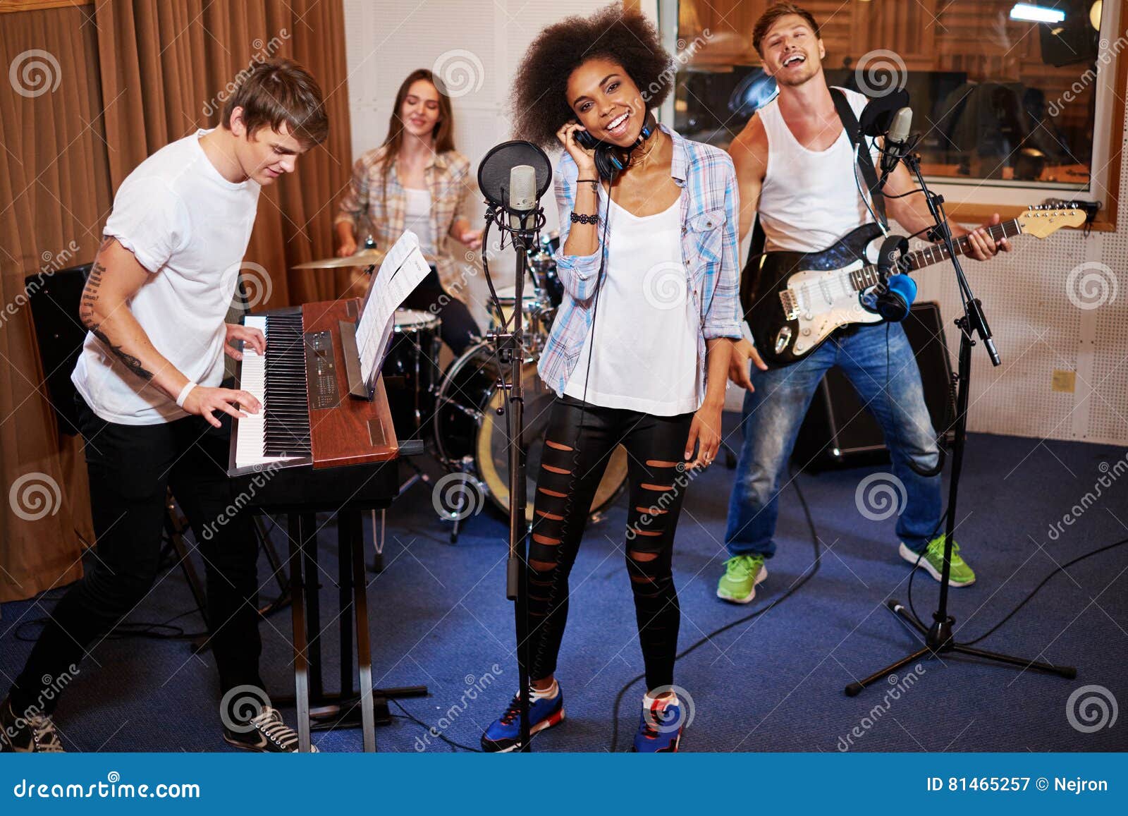 Multiracial Music Band Performing in a Recording Studio Stock Image ...