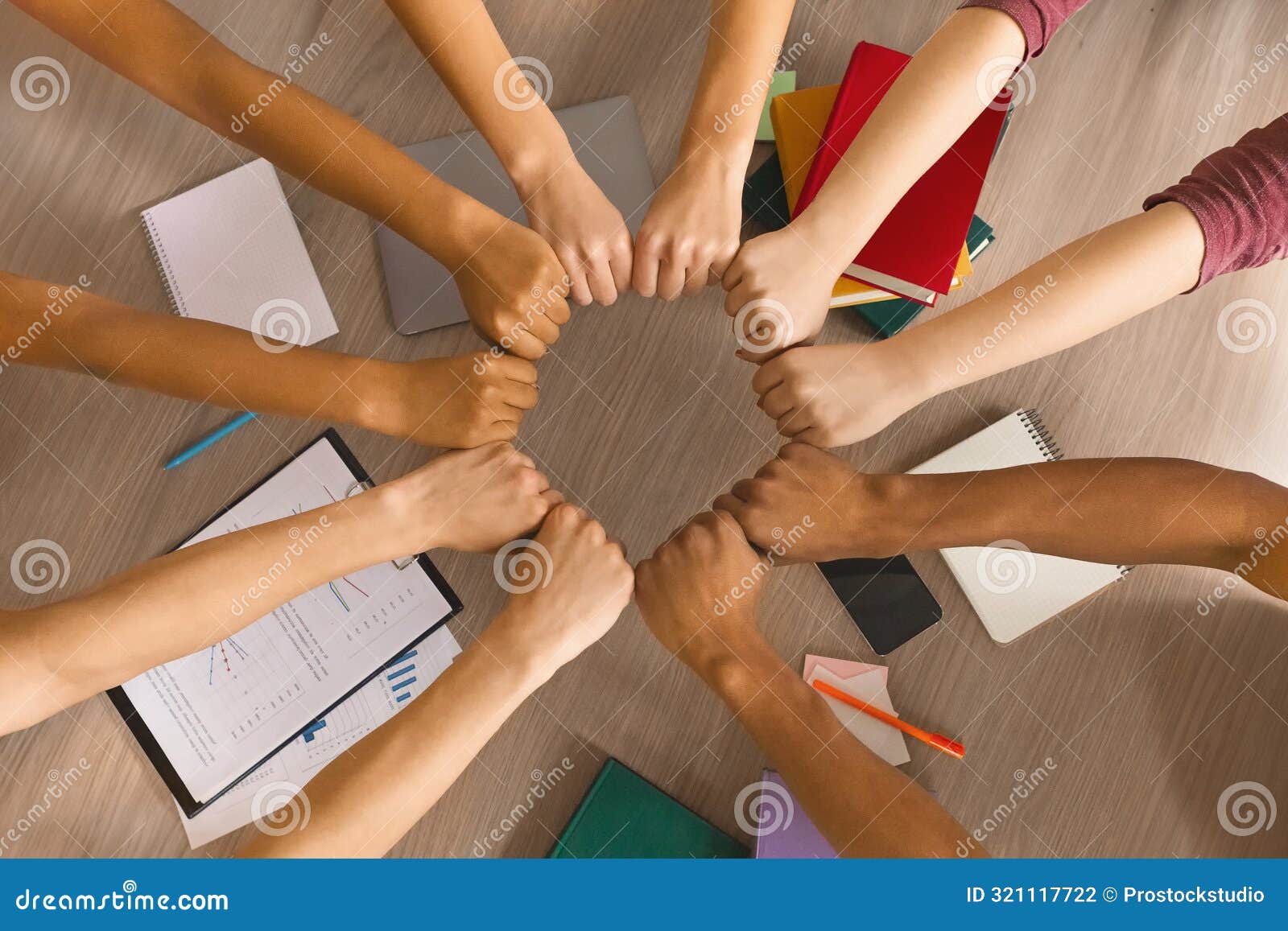 Multiracial Students Joining Hands Together in Cooperation Stock Photo ...