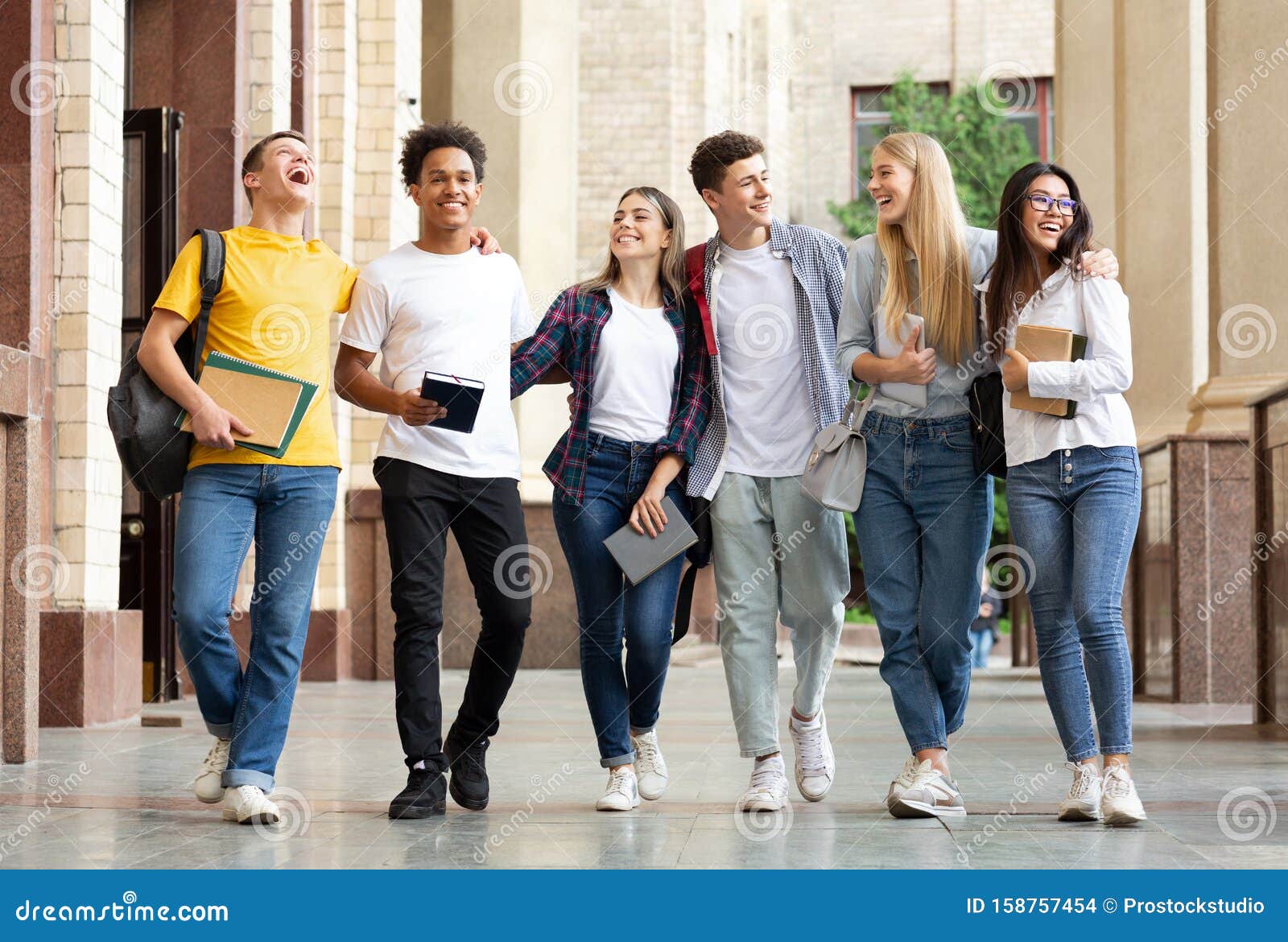 Multiracial Students Walking after Classes in University Campus Stock ...