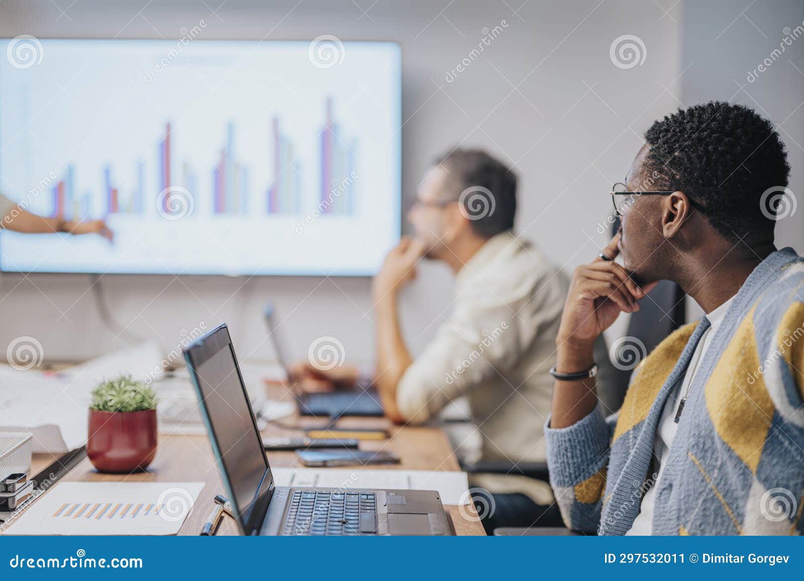 Multiracial Team Collaborates on Architectural Blueprints and Graph ...