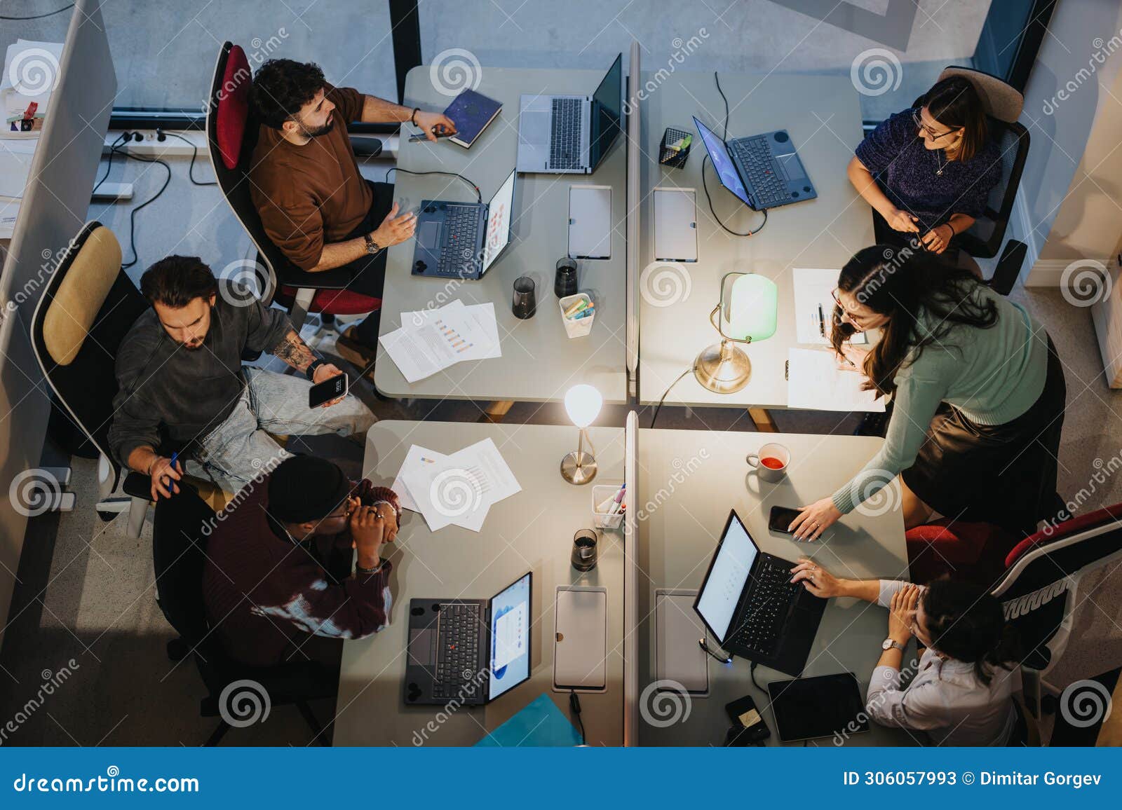 Multiracial Team of Coworkers Engaged in Collaborative Work at Modern ...