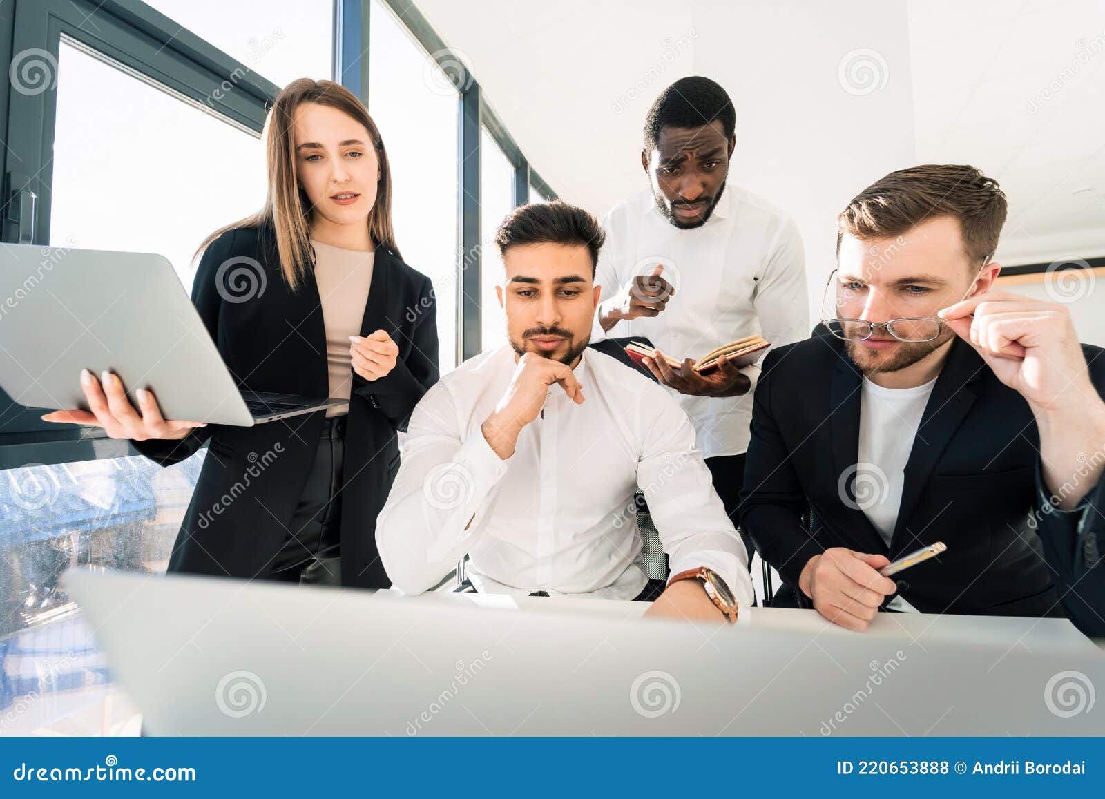 Multiracial Team of Programmers Working Together on a New Assignment ... Multiracial Team of Programmers Working Together on a New Assignment ...
