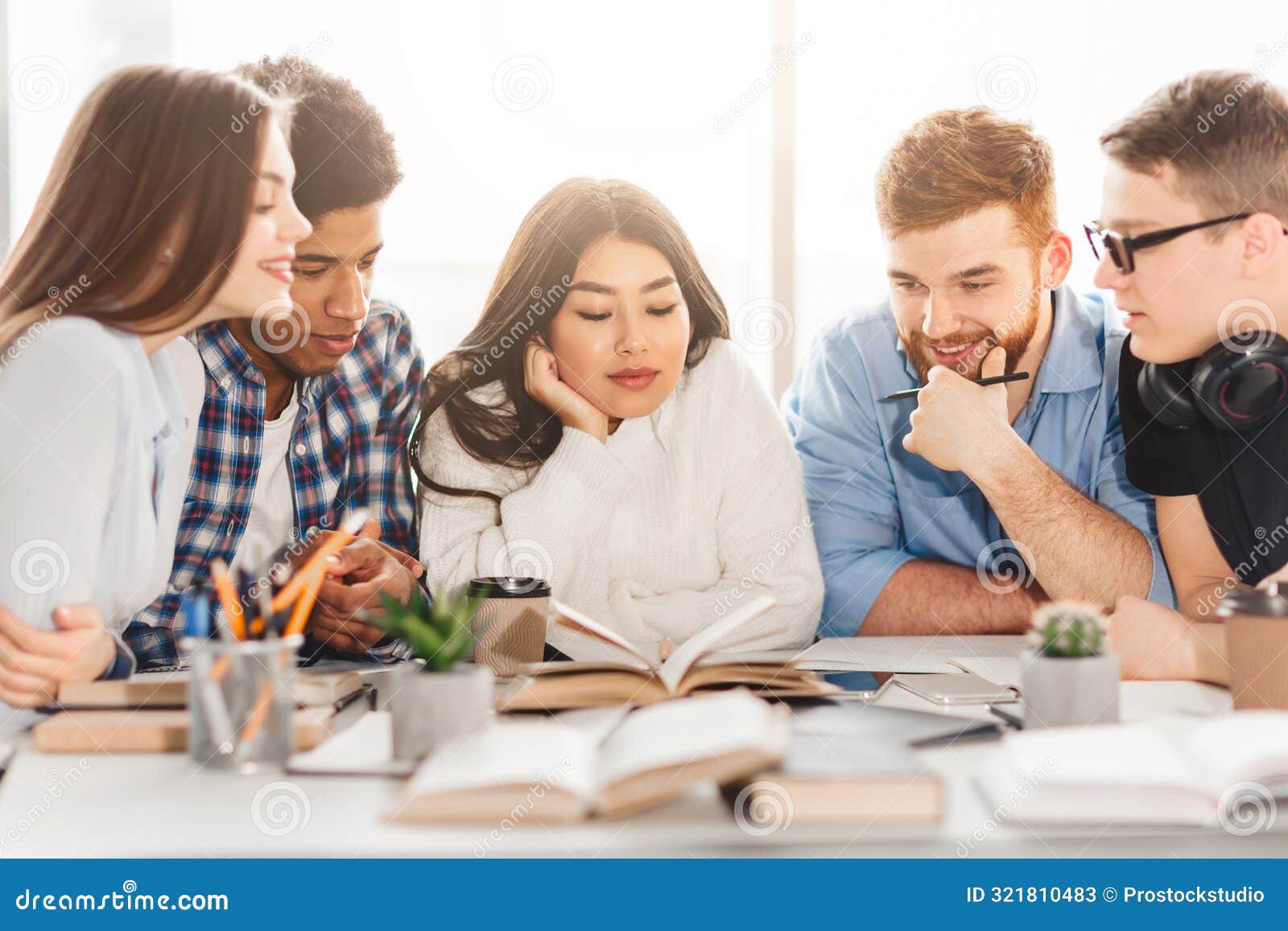 Multiracial Teamwork with Books at the Library Stock Image - Image of ...