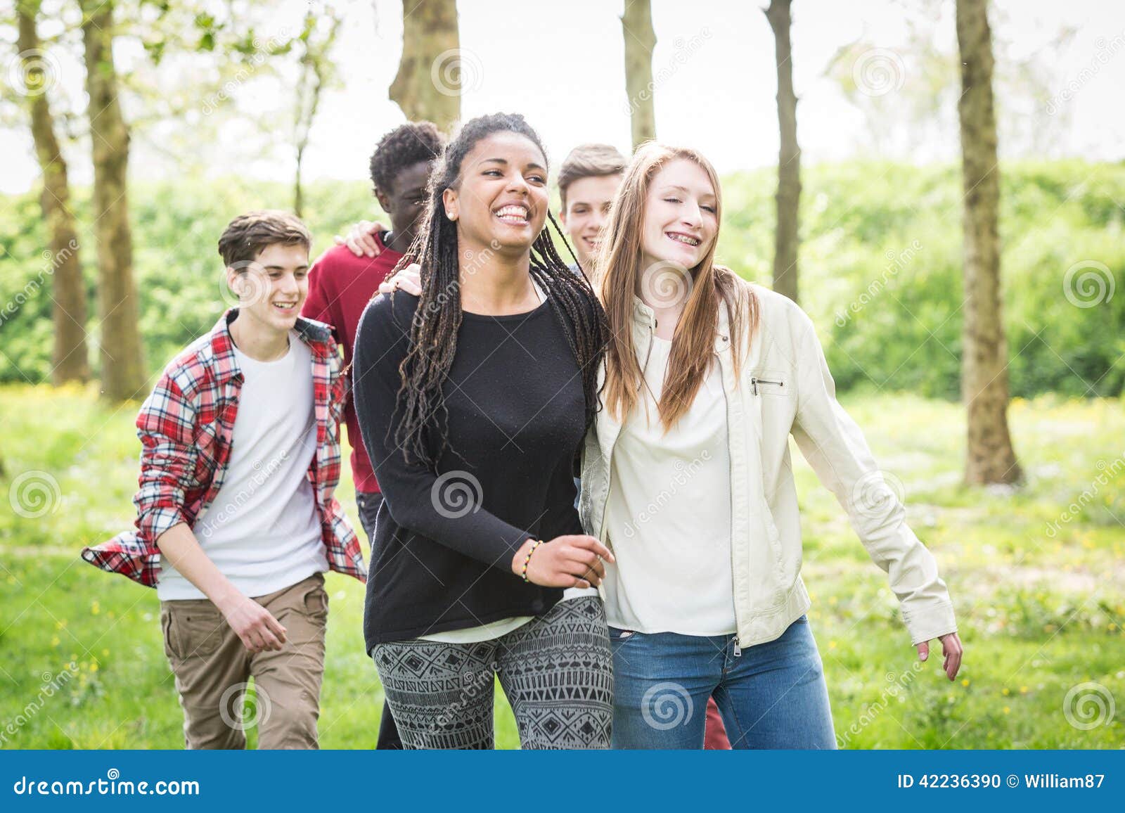 Multiracial Teenagers stock photo. Image of embraced - 42236390