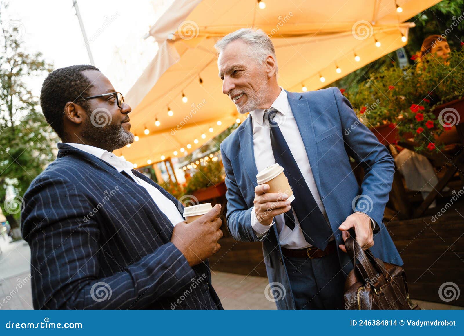 Multiracial Two Men Wearing Suits Talking while Drinking Coffee Stock ...