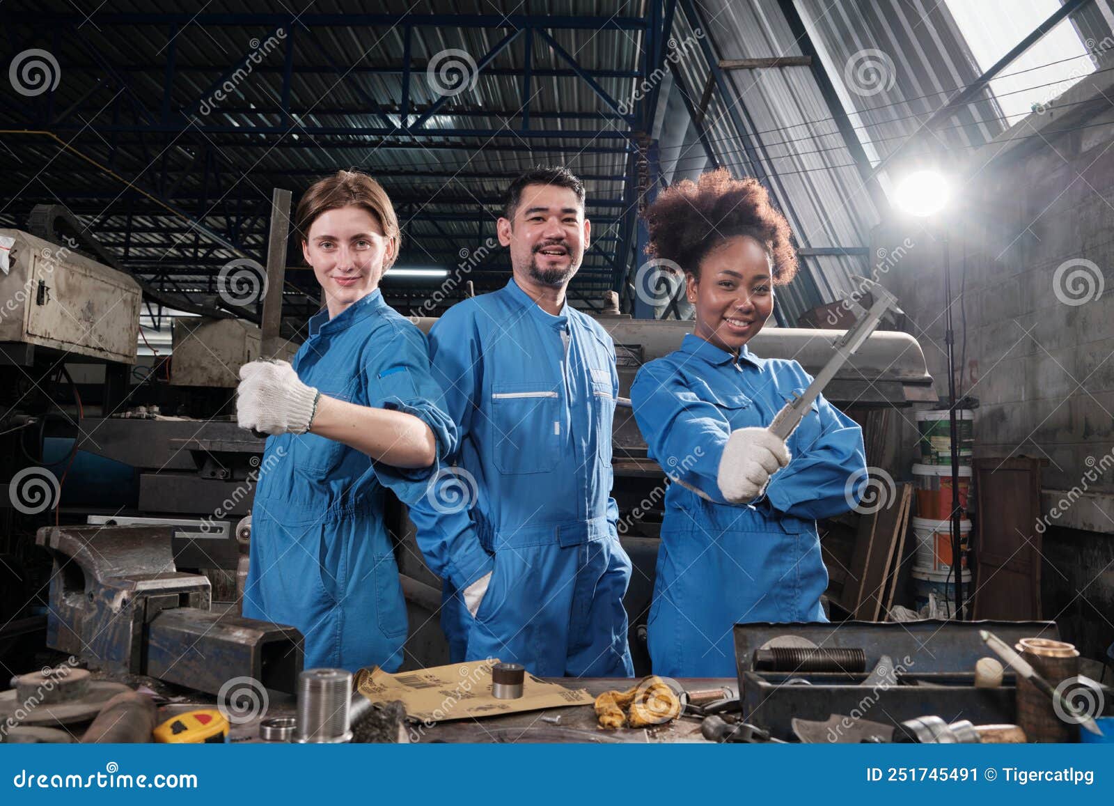 Multiracial Workers Collaborate and Express Happy Work in a Mechanical ...