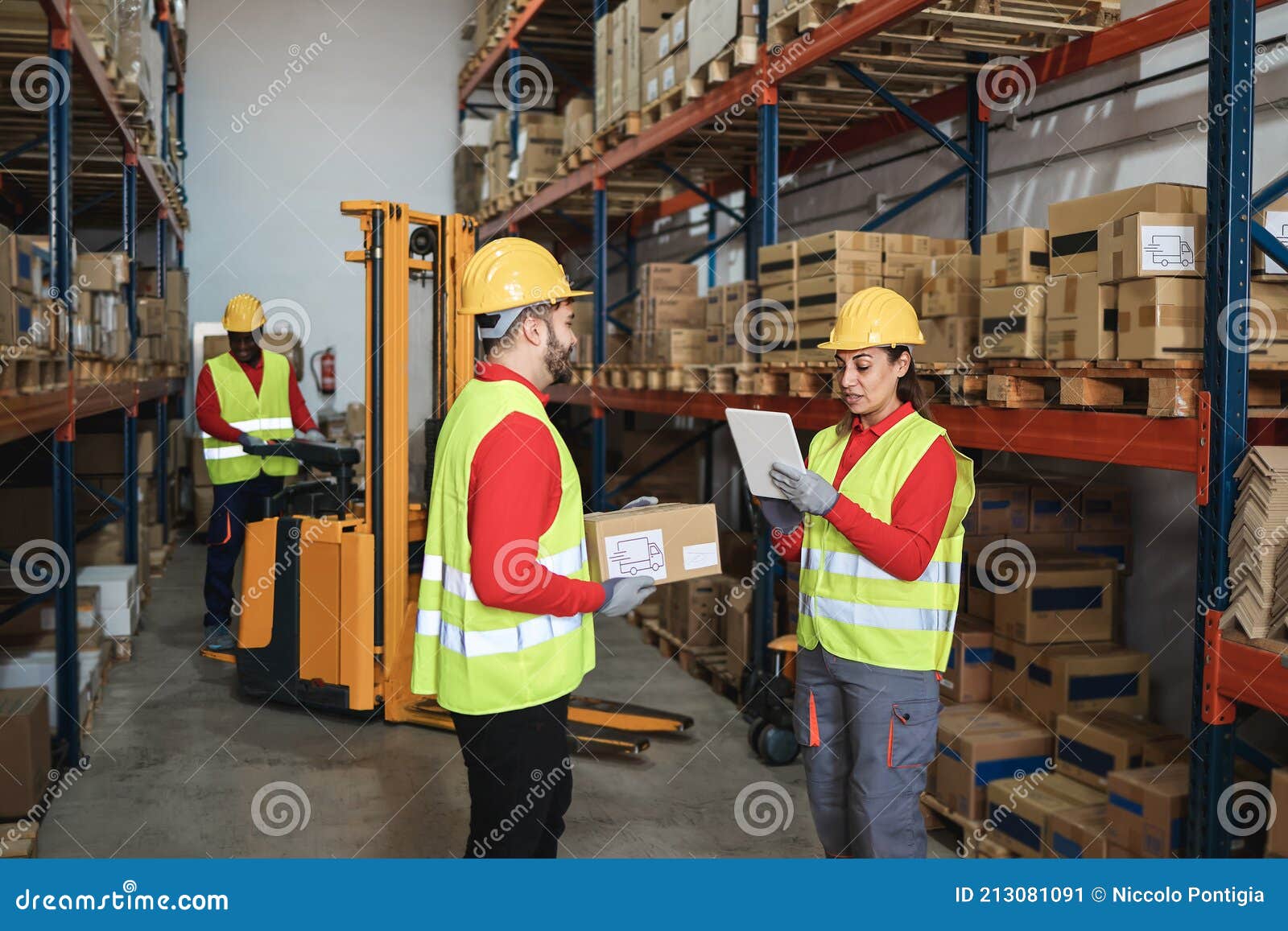 Multiracial Workers Talking Inside Warehouse Store - Focus on Woman ...