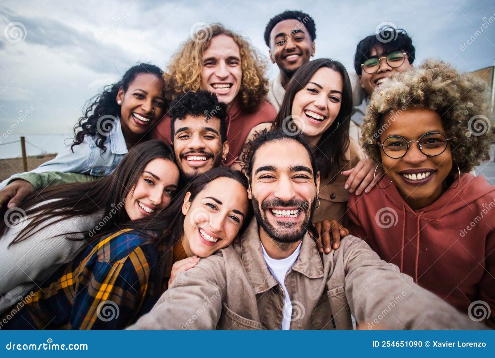 Multiracial Young Group Of Happy People Taking Selfie Together Stock
