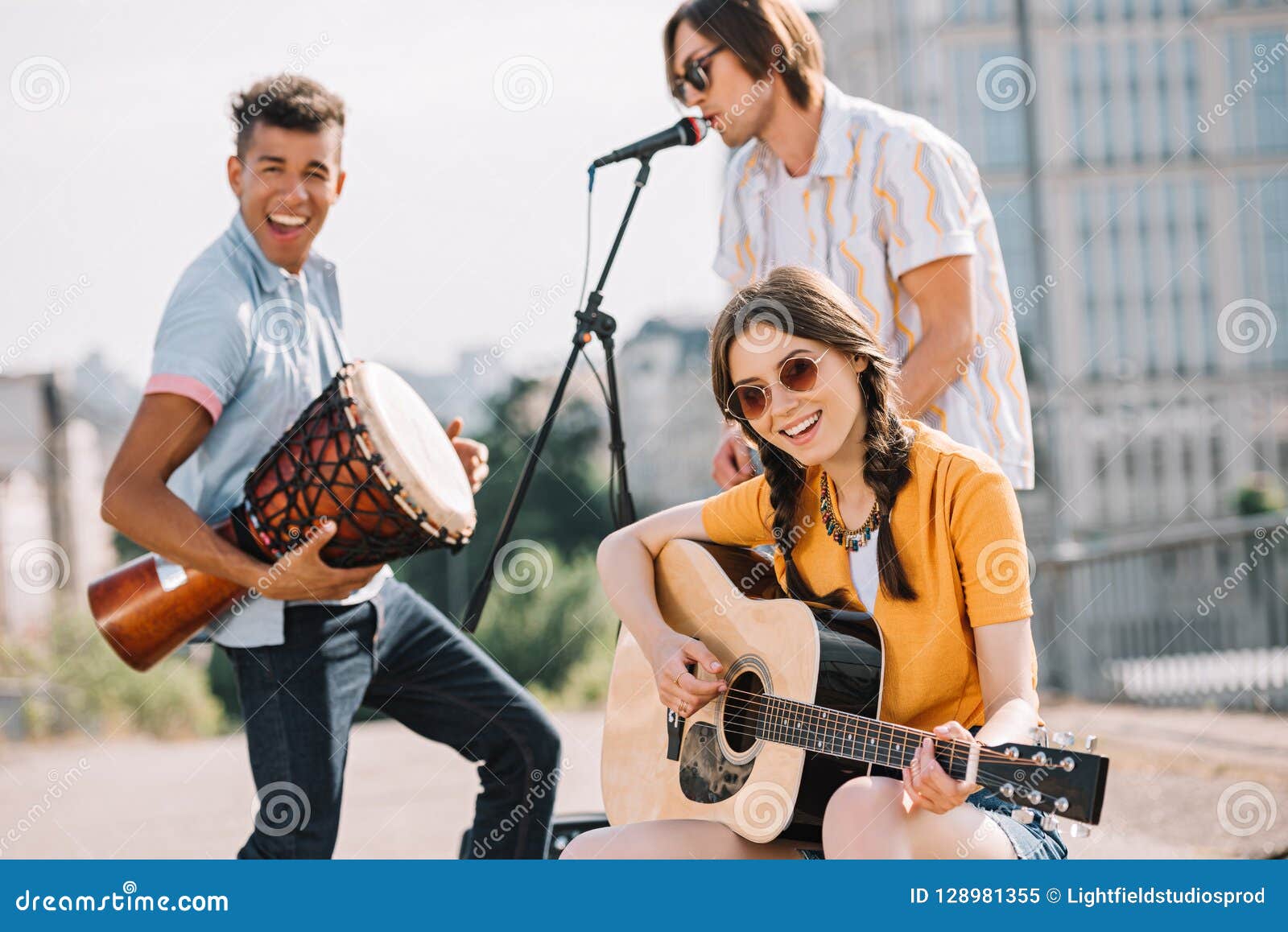 Multiracial Young People Performing Om Different Musical Instruments ...