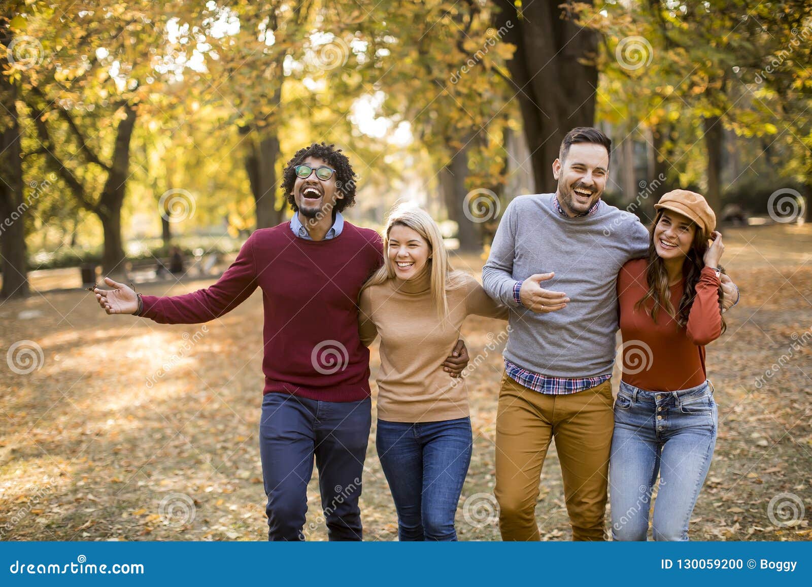 Multiracial Young People Walking in the Autumn Park Stock Photo - Image ...