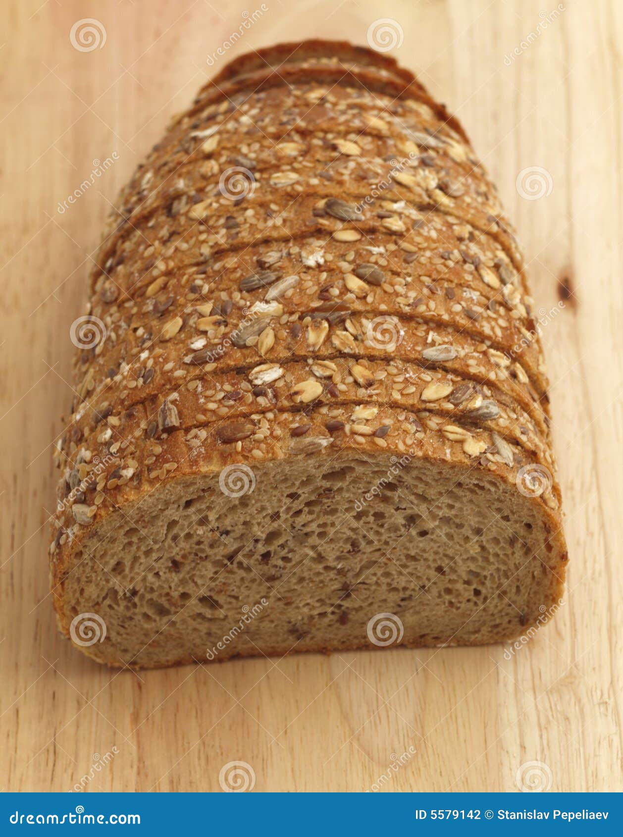 Multiseed Bread on Wooden Board Stock Photo - Image of wooden, cutting: 5579142