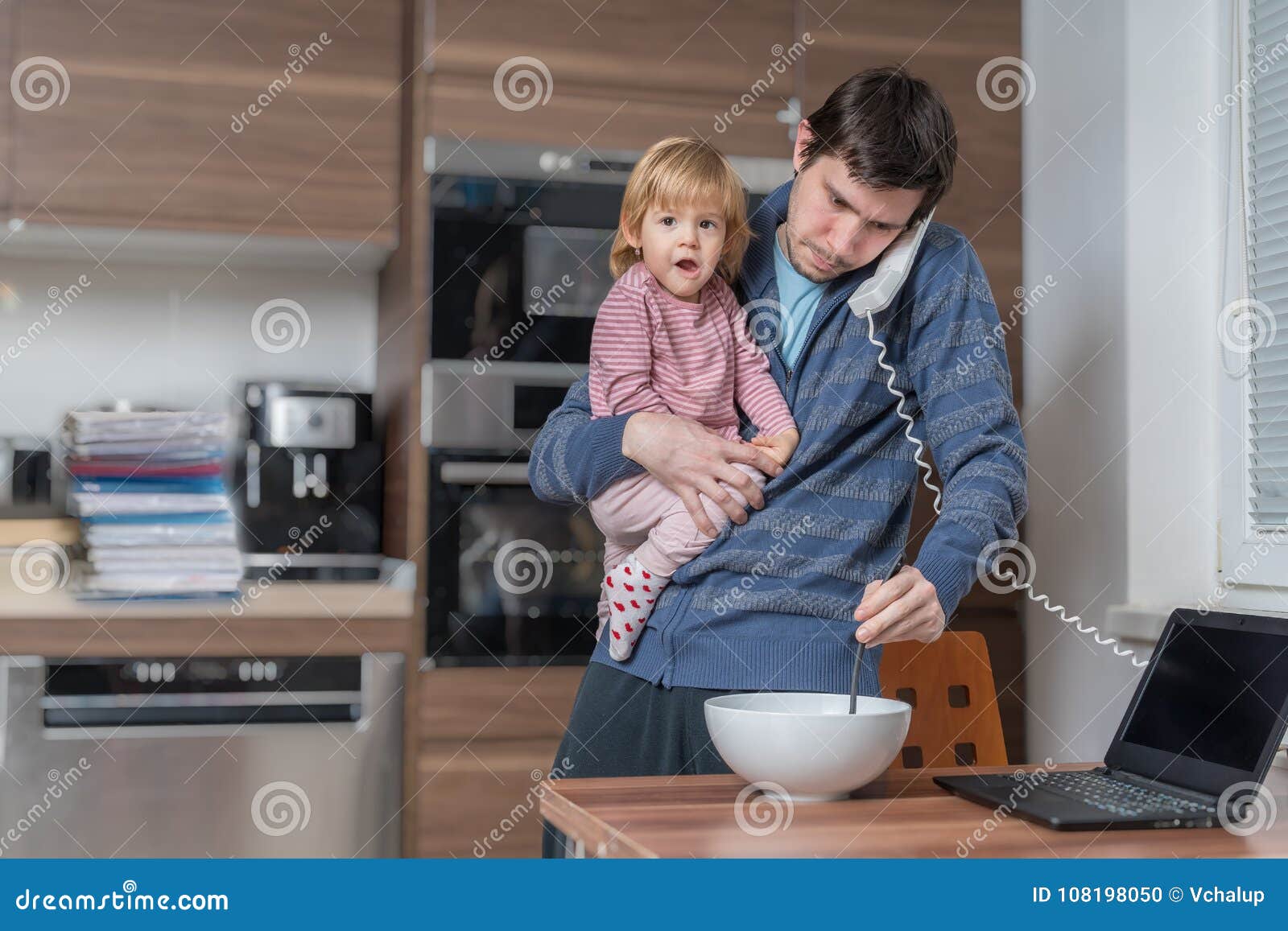 Multitasking Father is Babysitting and Working at Home Stock Photo ...