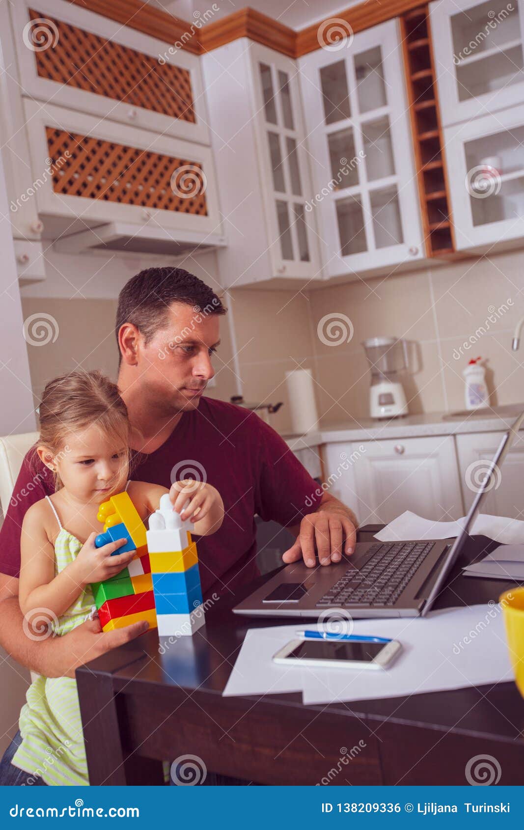 Multitasking Father is Babysitting and Working at Home Stock Photo ...