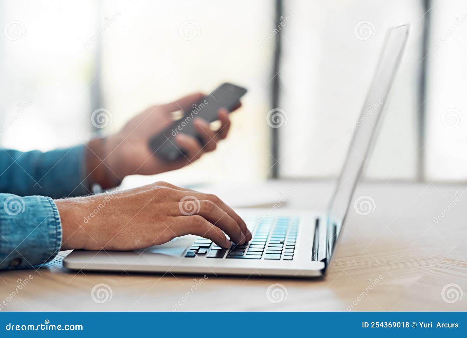 Multitasking Like a Boss. an Unidentifiable Young Businessman Using His ...