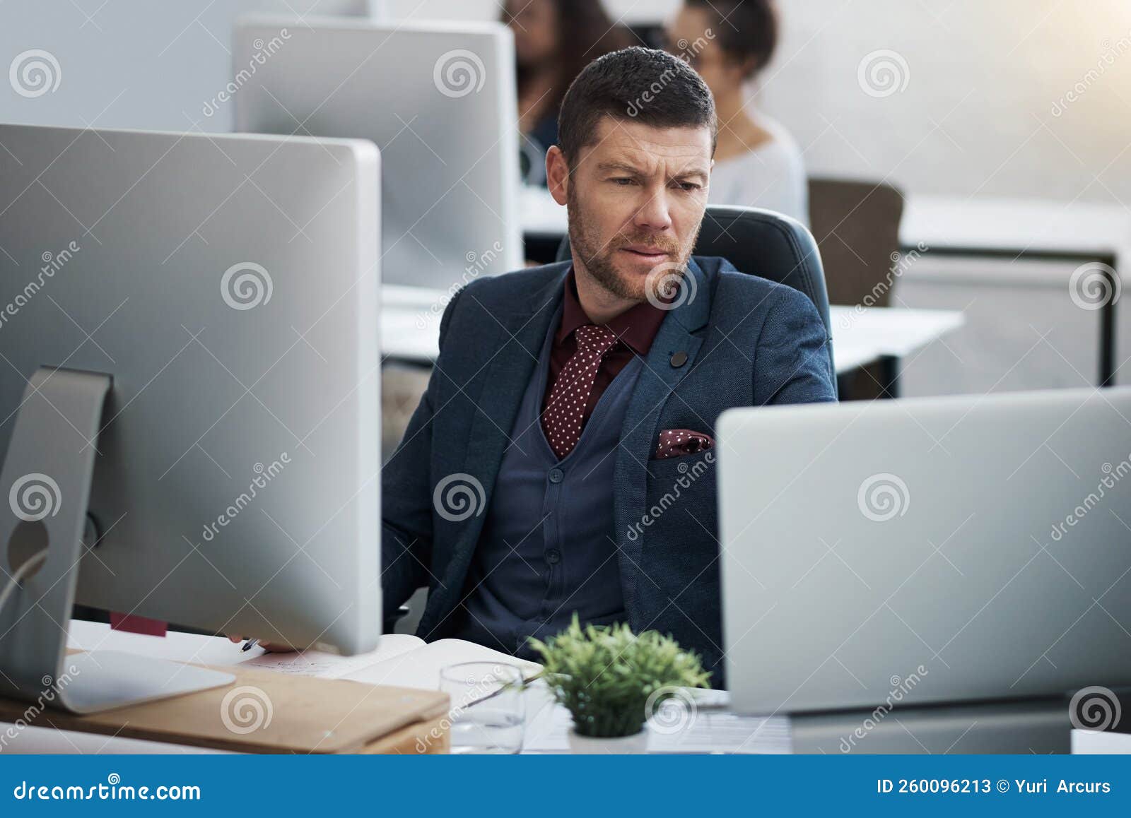 Multitasking Makes the Day the Success it is. a Mature Businessman ...