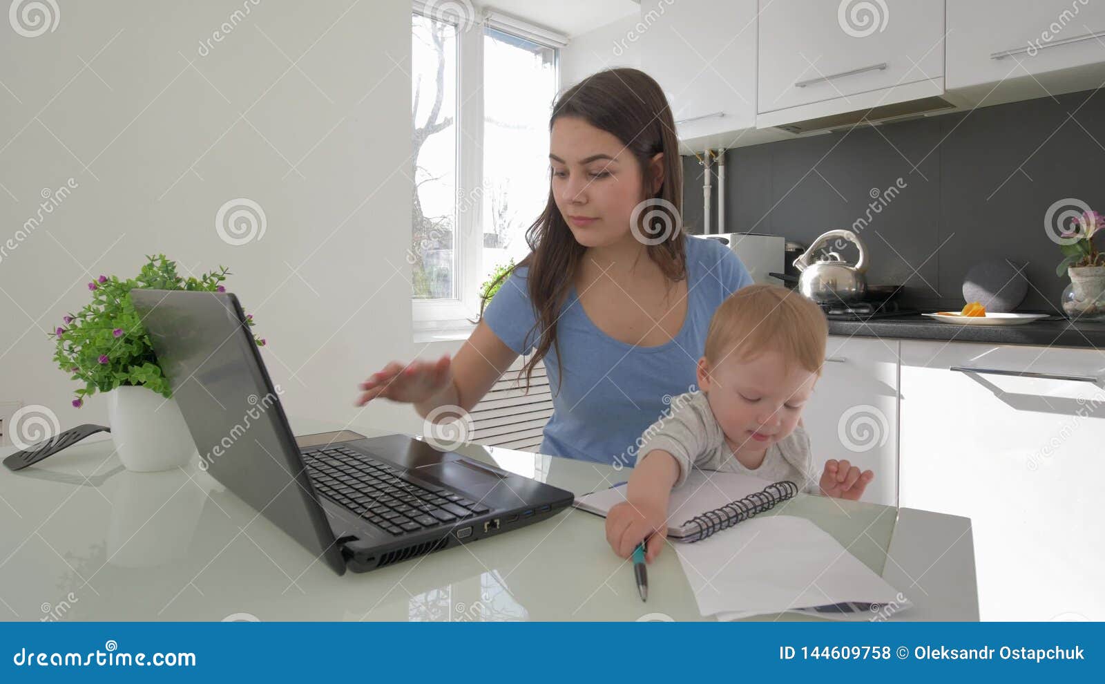 Multitasking Mom with Crying Toddler Boy Combining Parenting and ...
