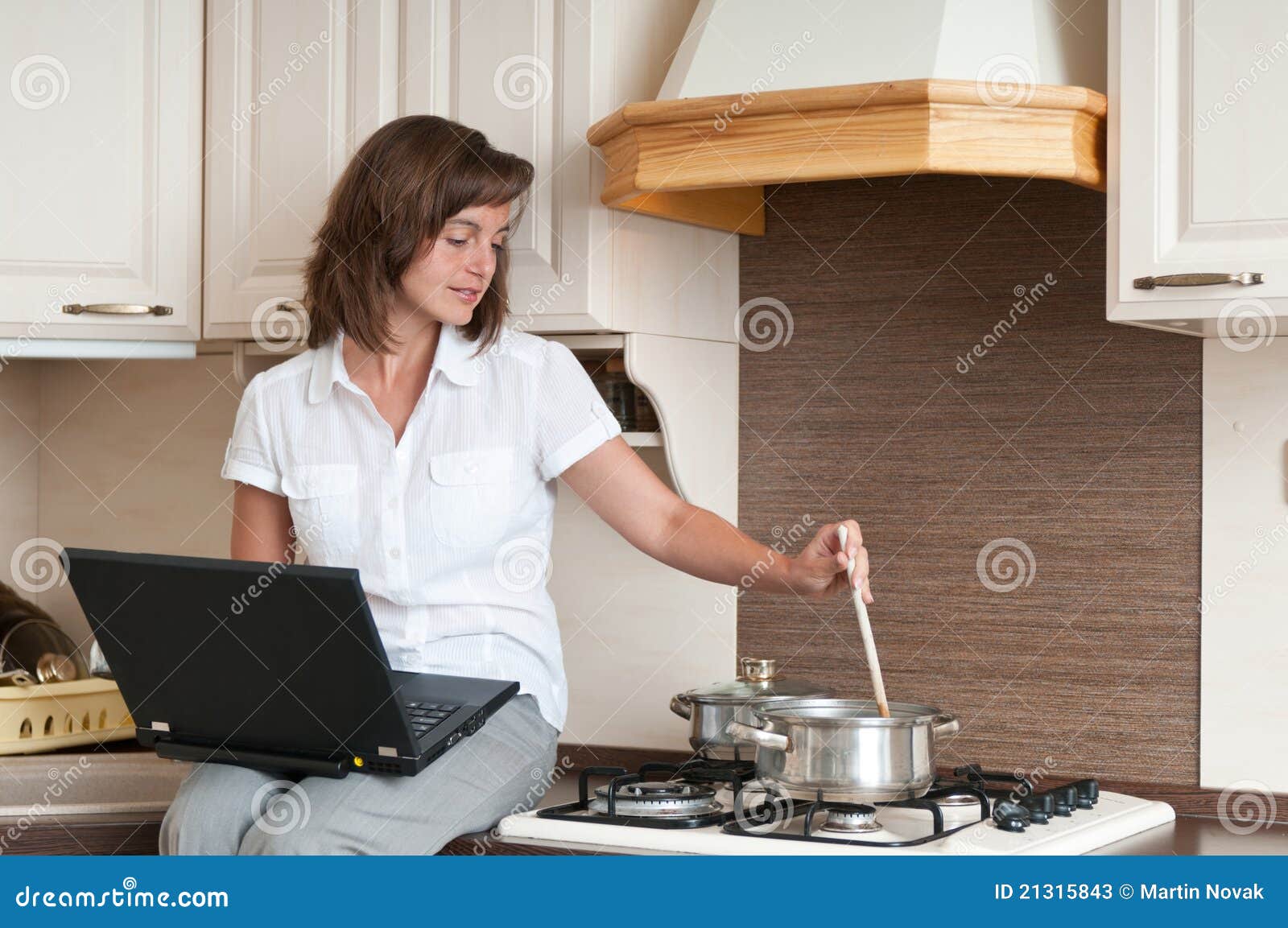 Multitasking - Preparing Meal and Working Stock Image - Image of cook ...