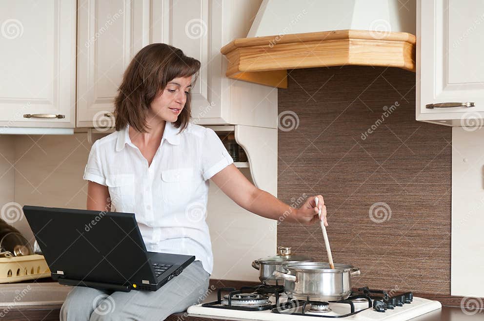 Multitasking - Preparing Meal and Working Stock Image - Image of cook ...
