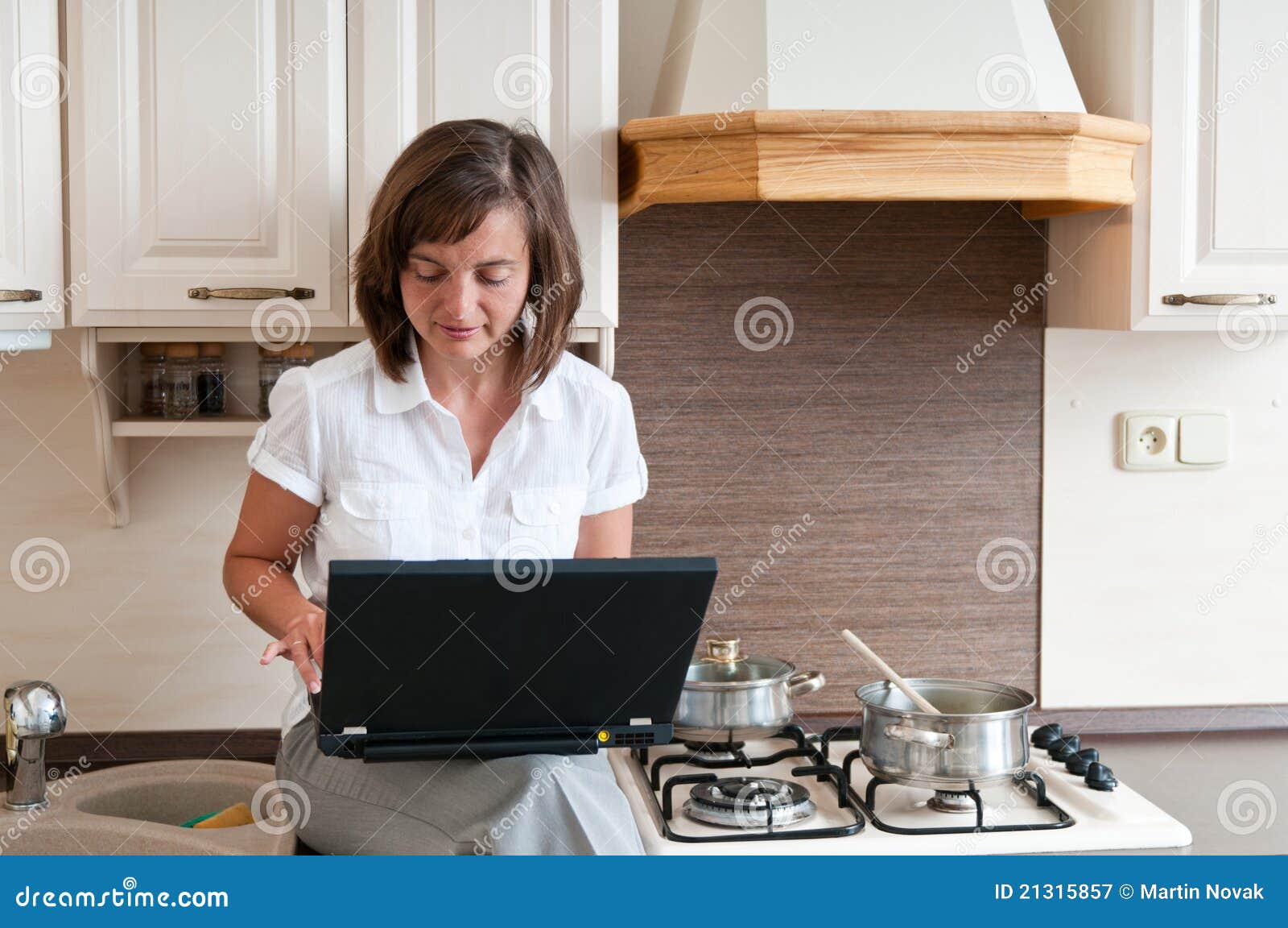 Multitasking - Preparing Meal and Working Stock Image - Image of ...