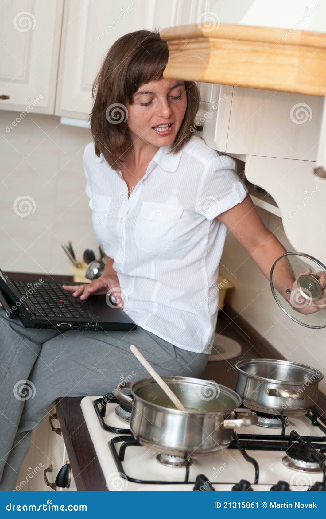 Multitasking - Preparing Meal and Working Stock Image - Image of ...