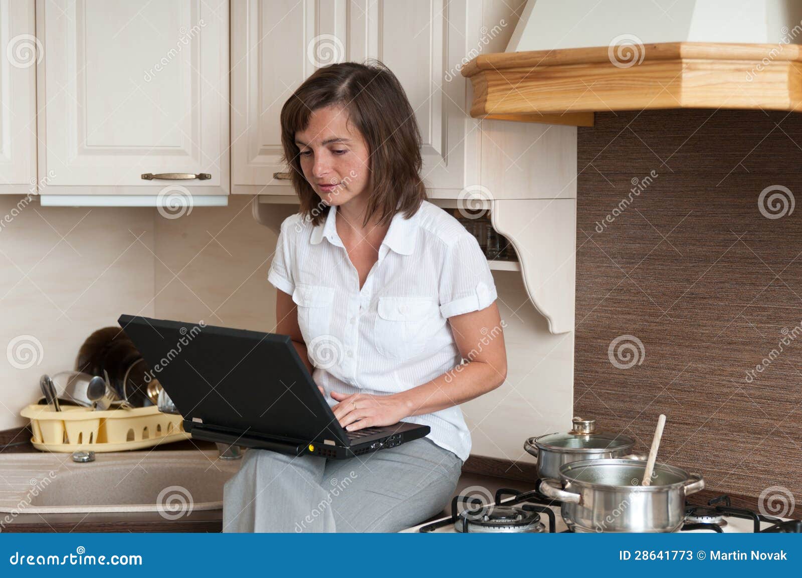 Multitasking - Preparing Meal and Working Stock Image - Image of ...