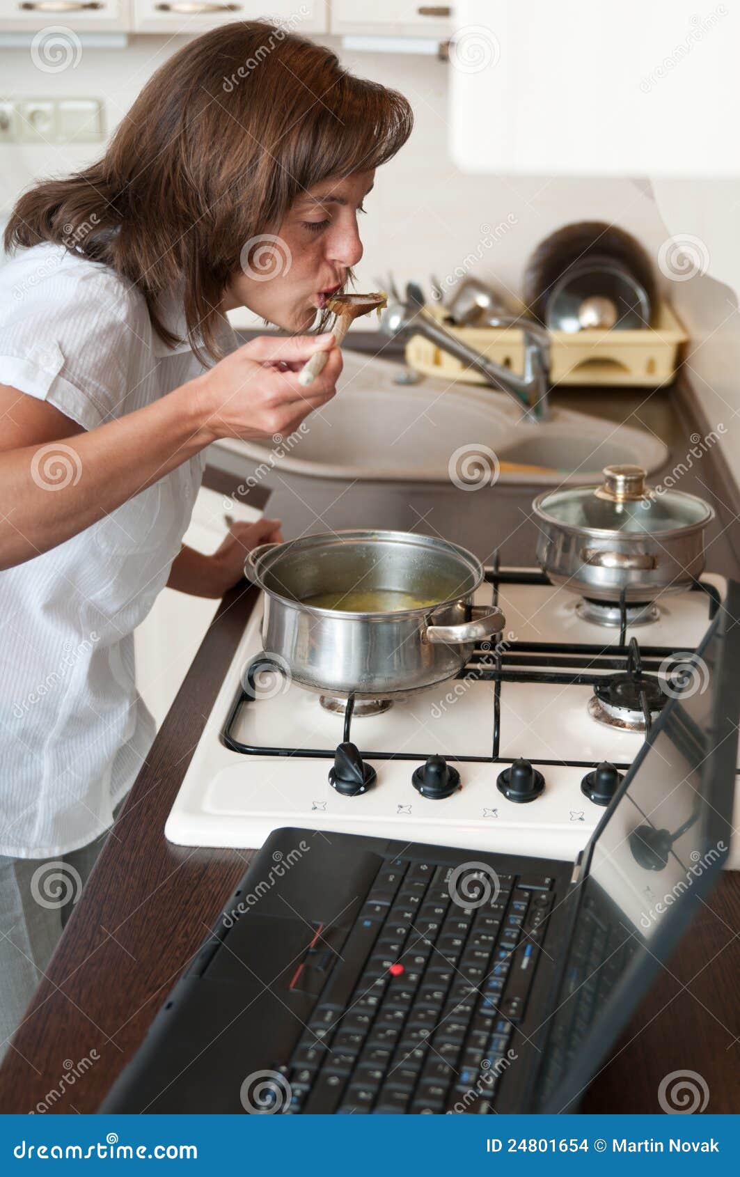 Multitasking Woman - Cooking Meal and Working Stock Photo - Image of ...