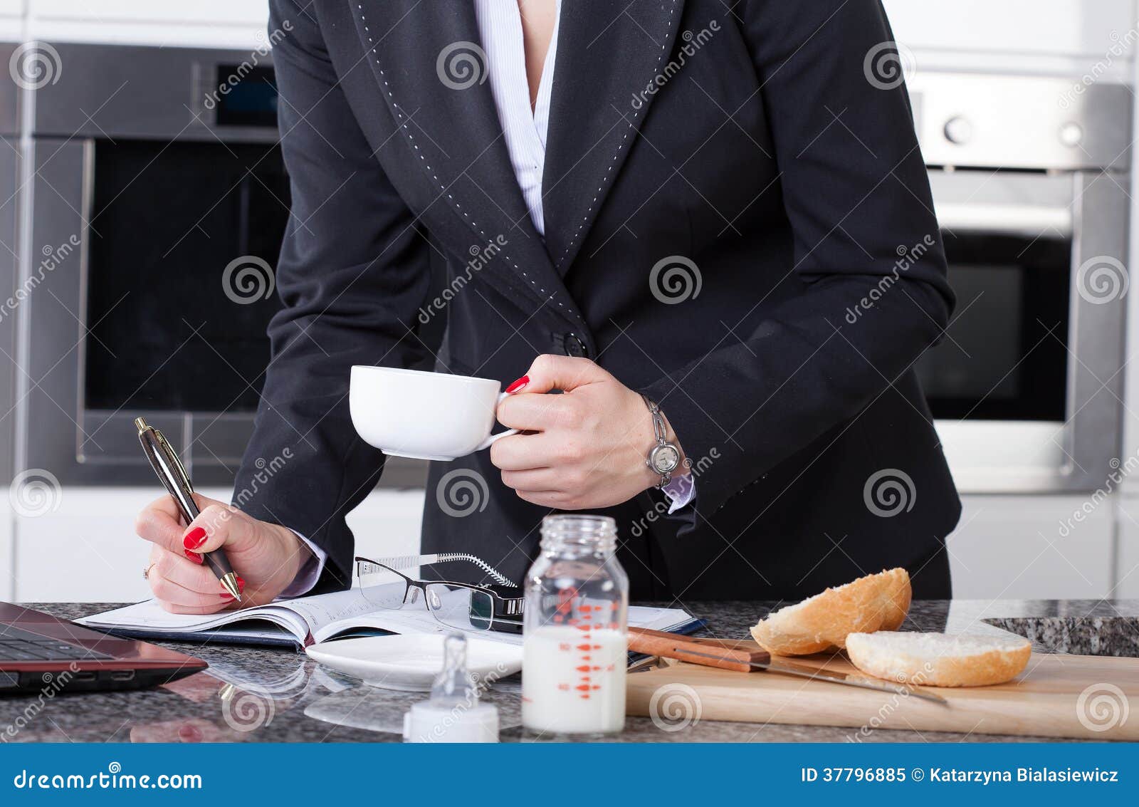 Multitasking Woman in Kitchen Stock Image - Image of milk, household ...