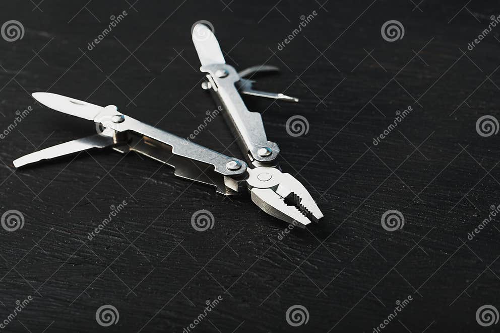Multitool is a Multi-functional Tool on a Black Background. the Concept ...