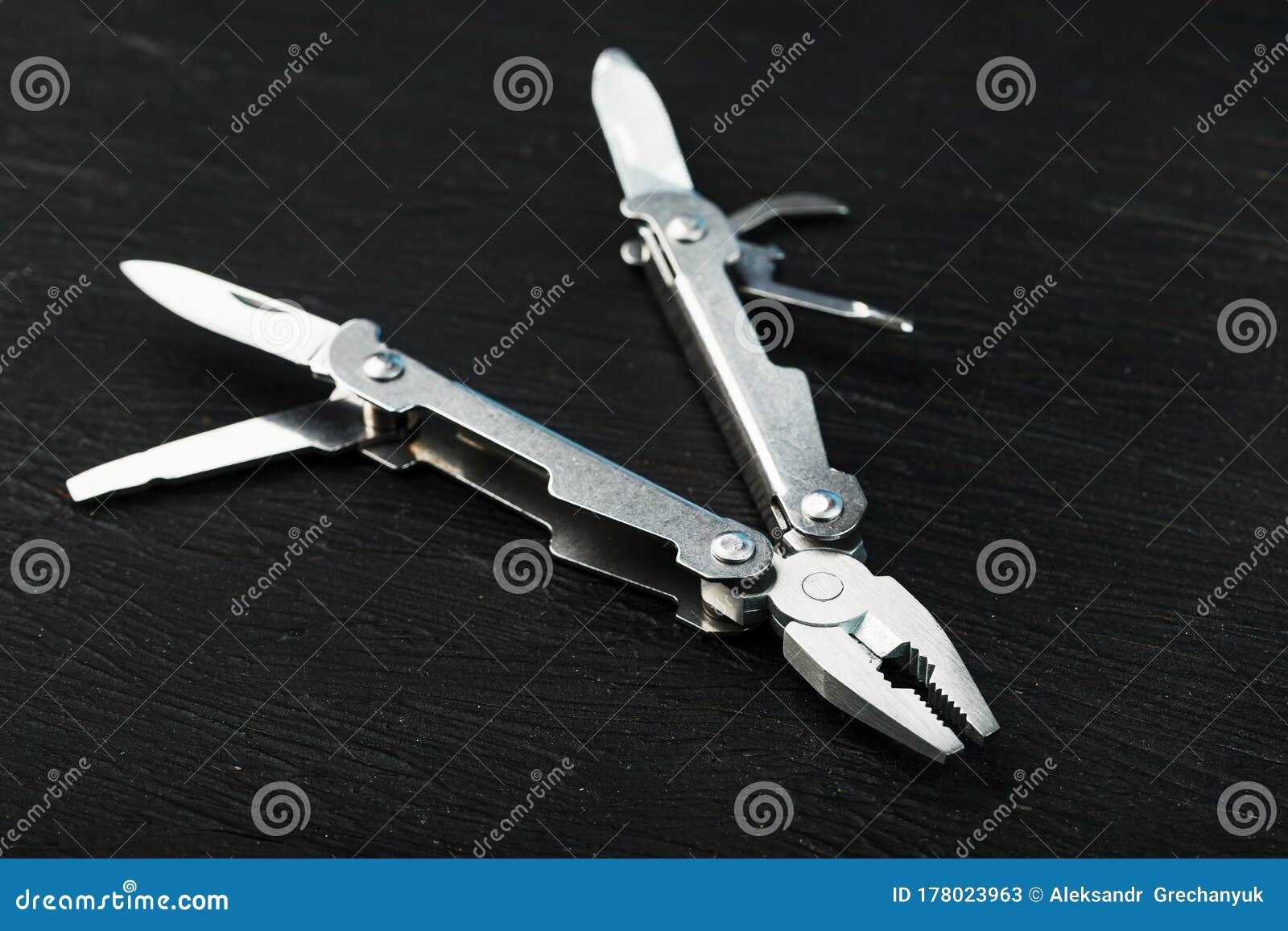Multitool is a Multi-functional Tool on a Black Background. the Concept ...