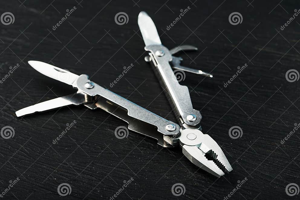 Multitool is a Multi-functional Tool on a Black Background. the Concept ...
