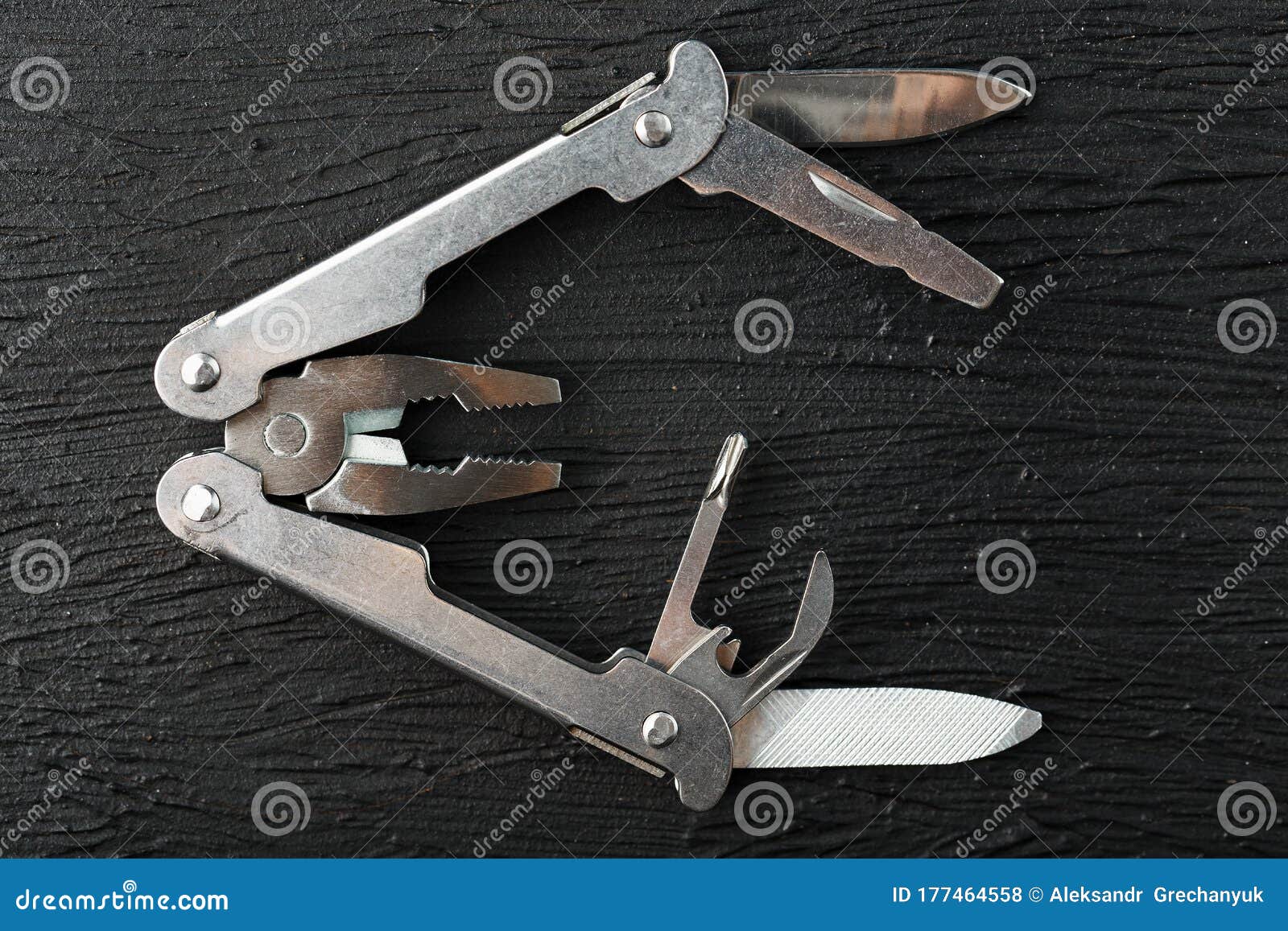 Multitool Is A Multi-functional Tool On A Black Background. The Concept ...
