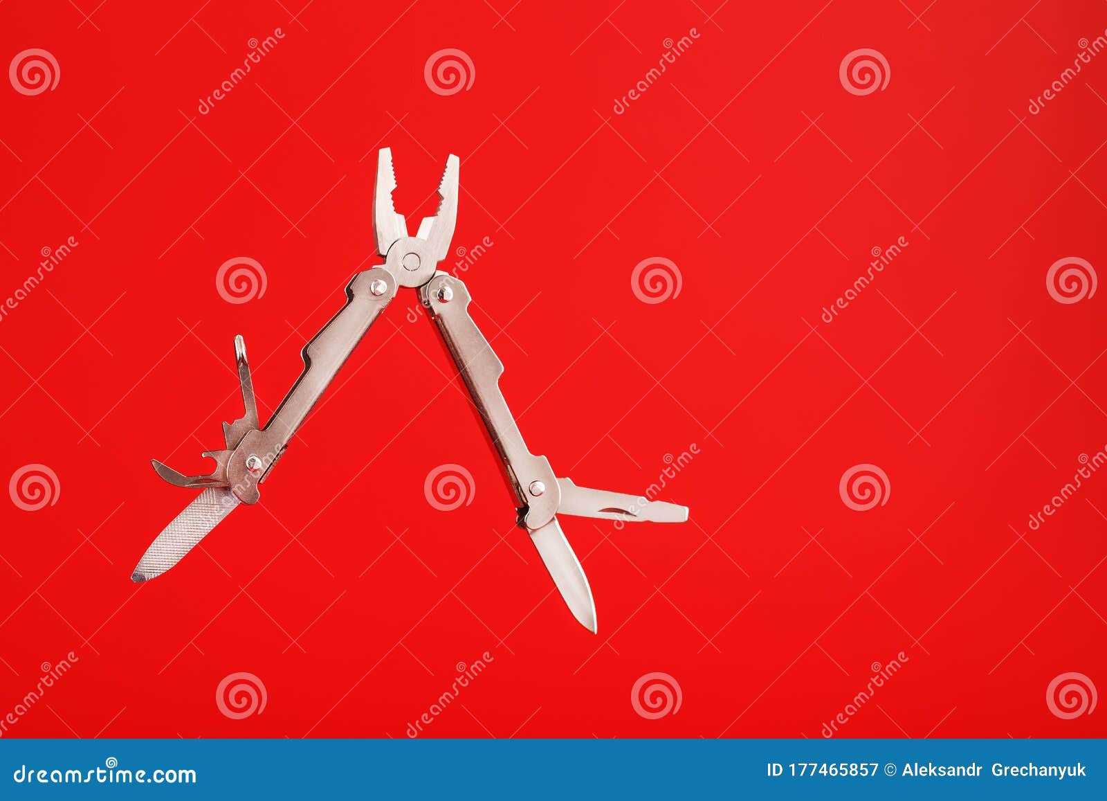 Multitool is a Multi-functional Tool on a Red Background. the Concept ...