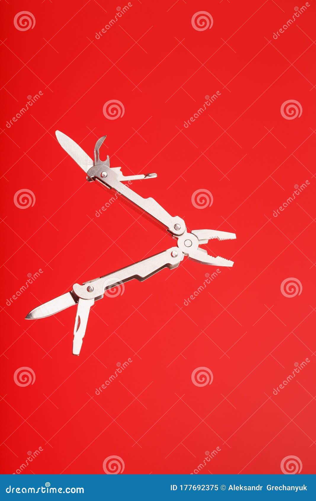 Multitool is a Multi-functional Tool on a Red Background. the Concept ...