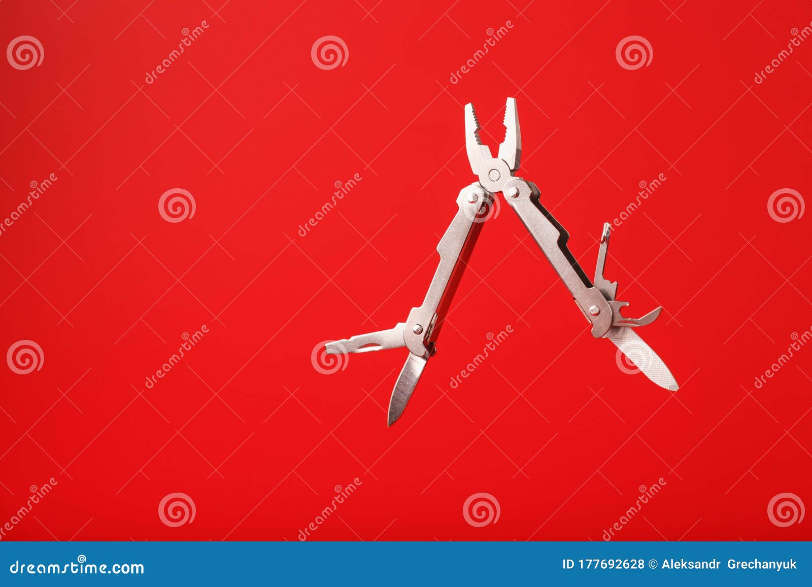 Multitool is a Multi-functional Tool on a Red Background. the Concept ...