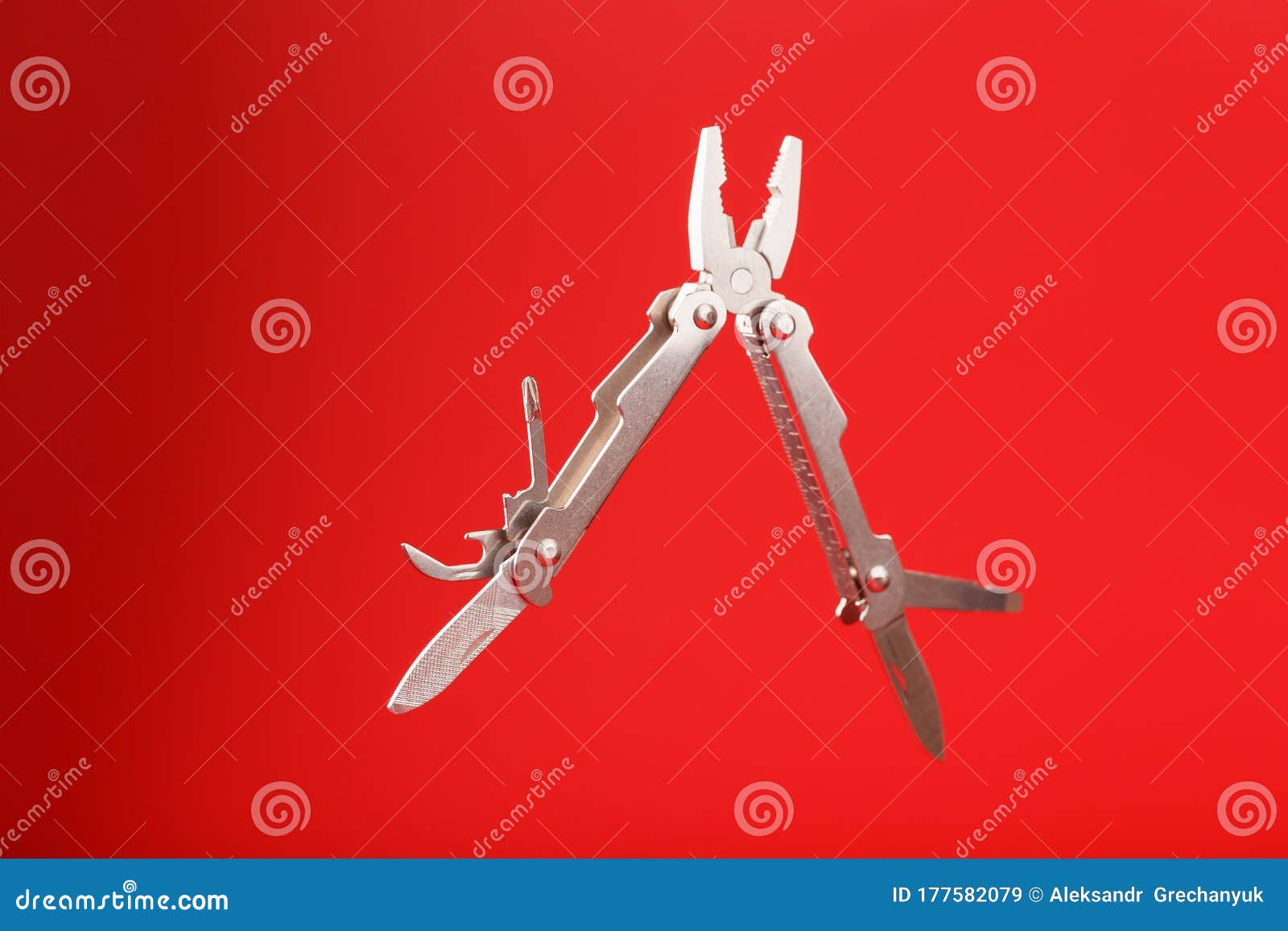 Multitool is a Multi-functional Tool on a Red Background. the Concept ...
