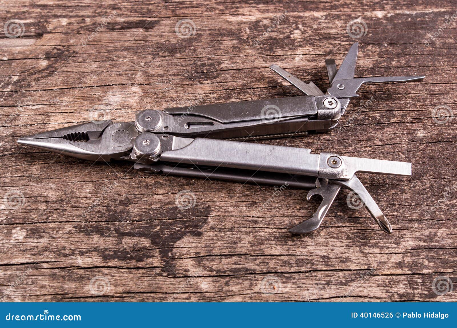 Multitool, Multi Purpose Tool on Wood Stock Photo - Image of stainless ...