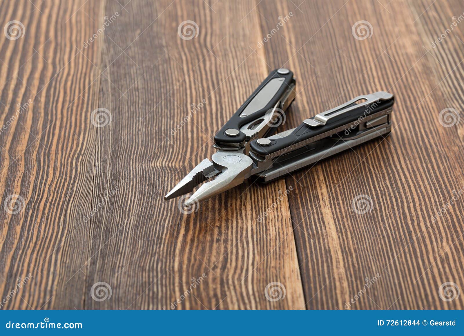 Multitool on Wooden Surface Stock Photo - Image of handle, models: 72612844