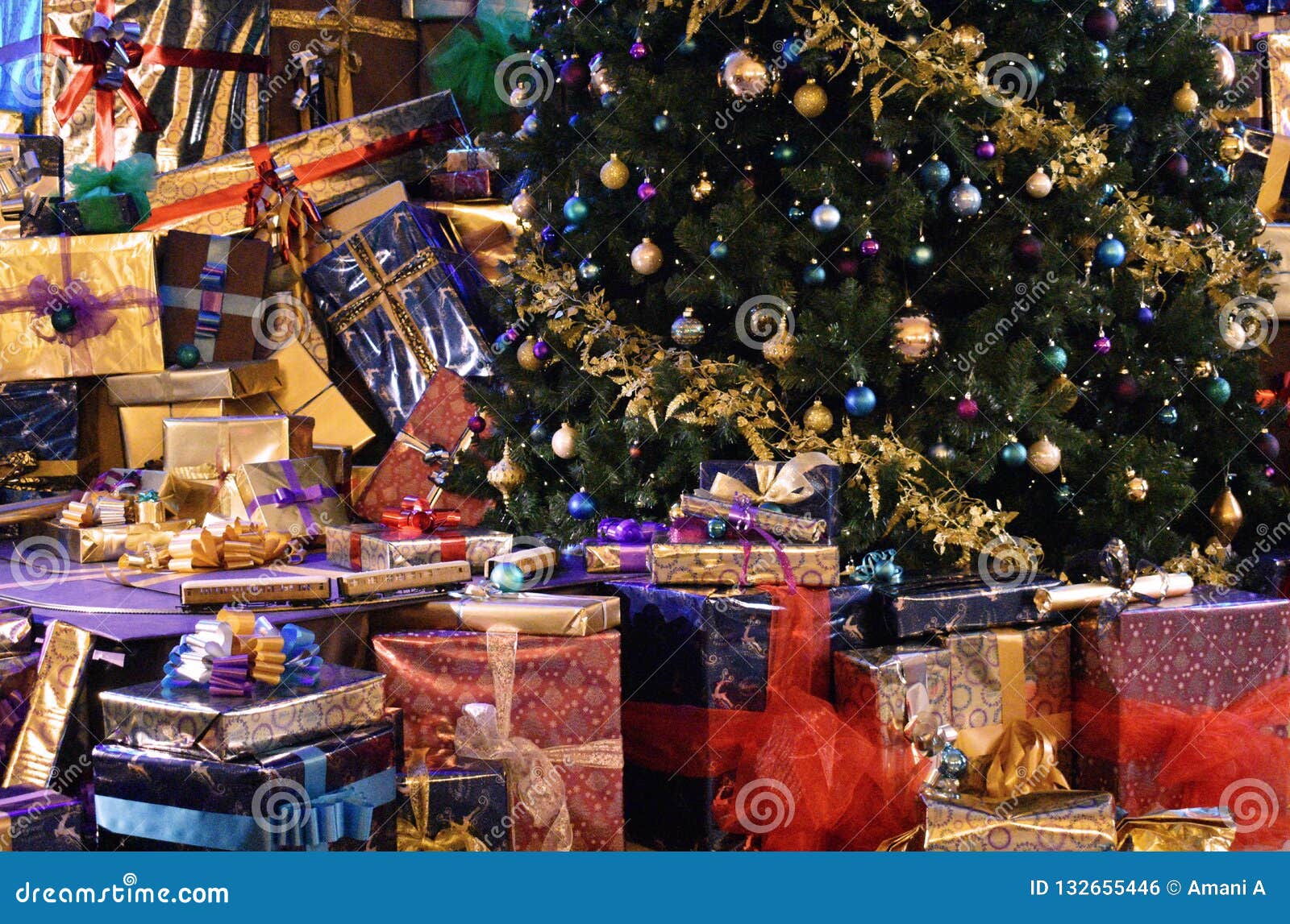 Christmas Gifts Round the Base of a Christmas Tree Stock Photo - Image ...
