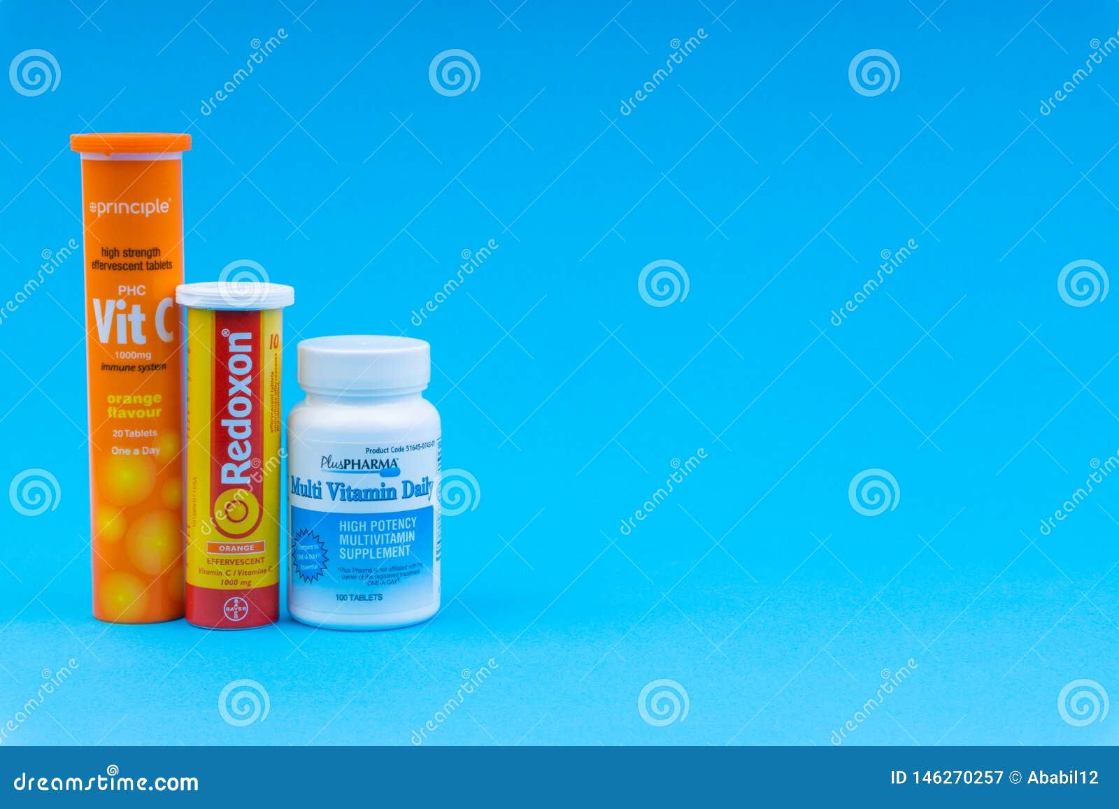 Multivitamin Tablets and Vitamin C Container Closeup. Editorial ...