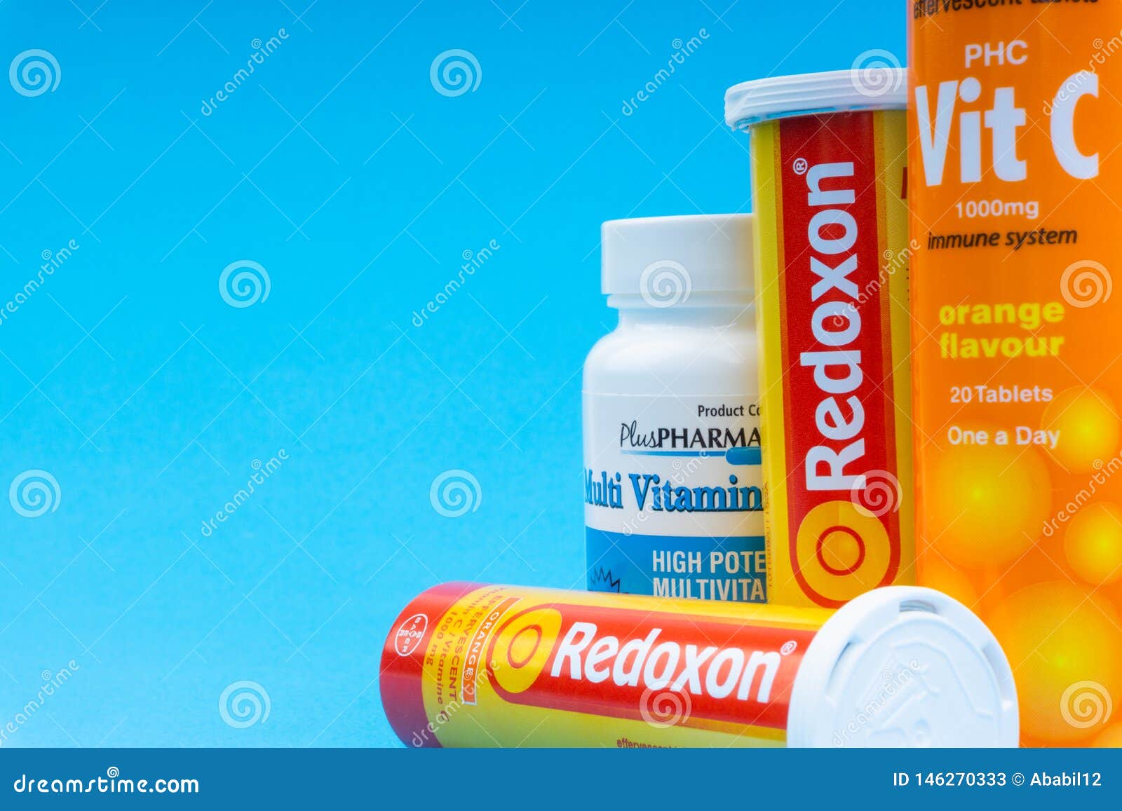 Multivitamin Tablets and Vitamin C Container Closeup. Editorial Stock ...