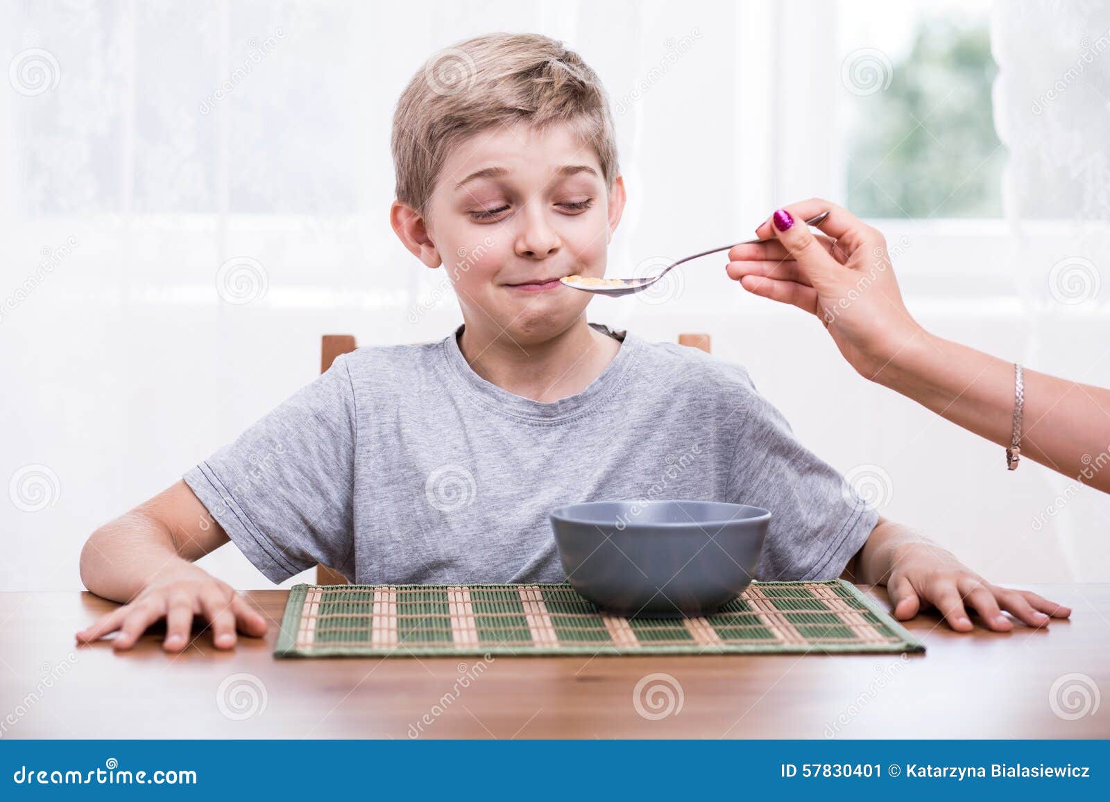 Mum feeding picky eater stock image. Image of fussy, eating - 57830401