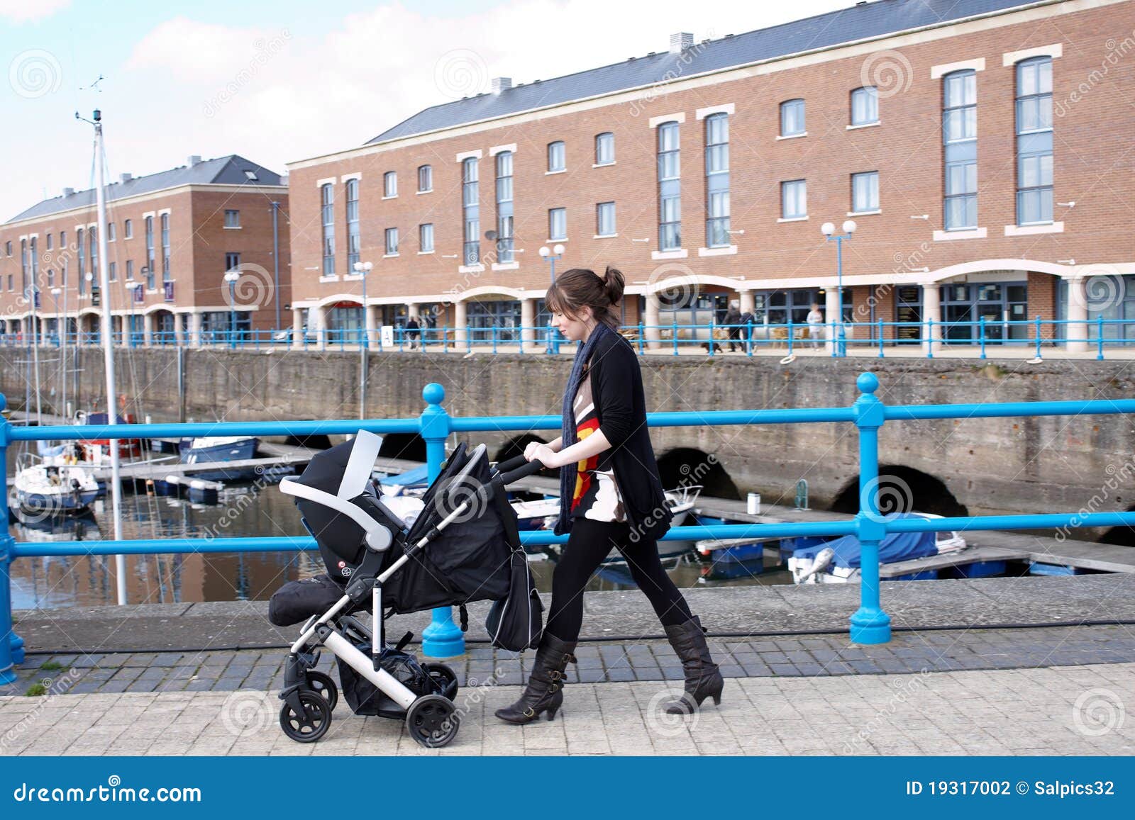 Mum pushing a pram stock photo. Image of water, adult - 19317002