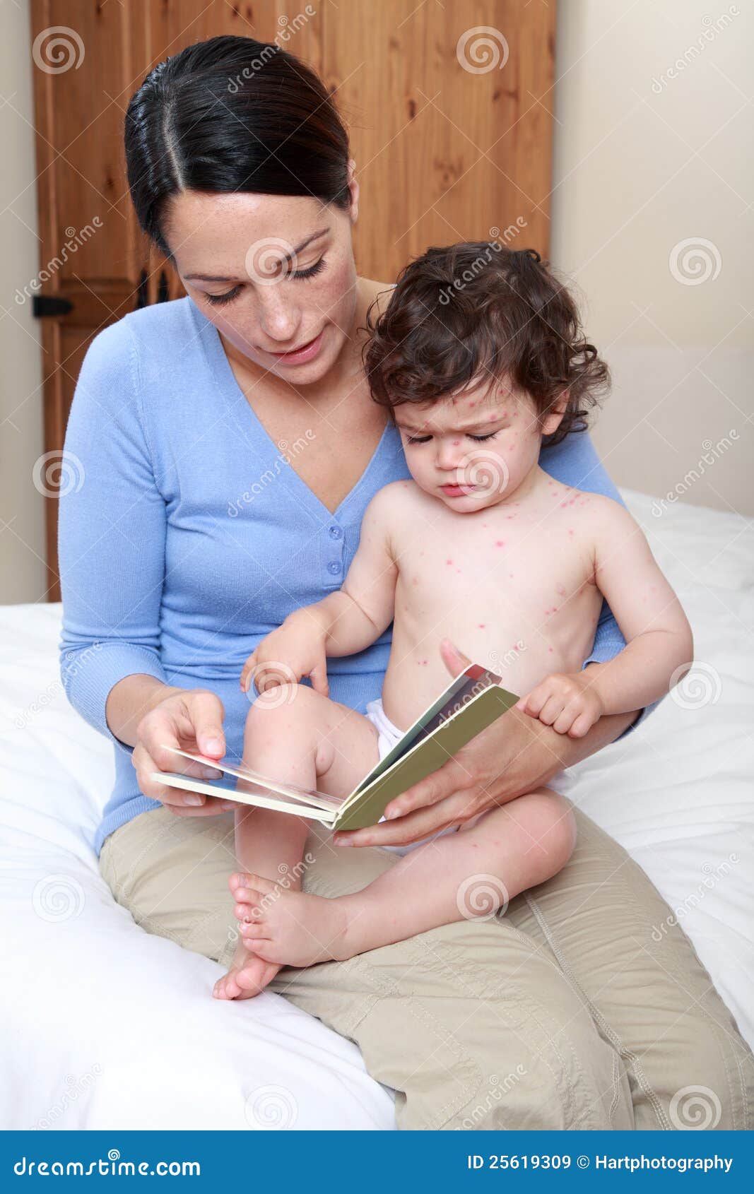 Mum reading to ill baby stock image. Image of infection - 25619309