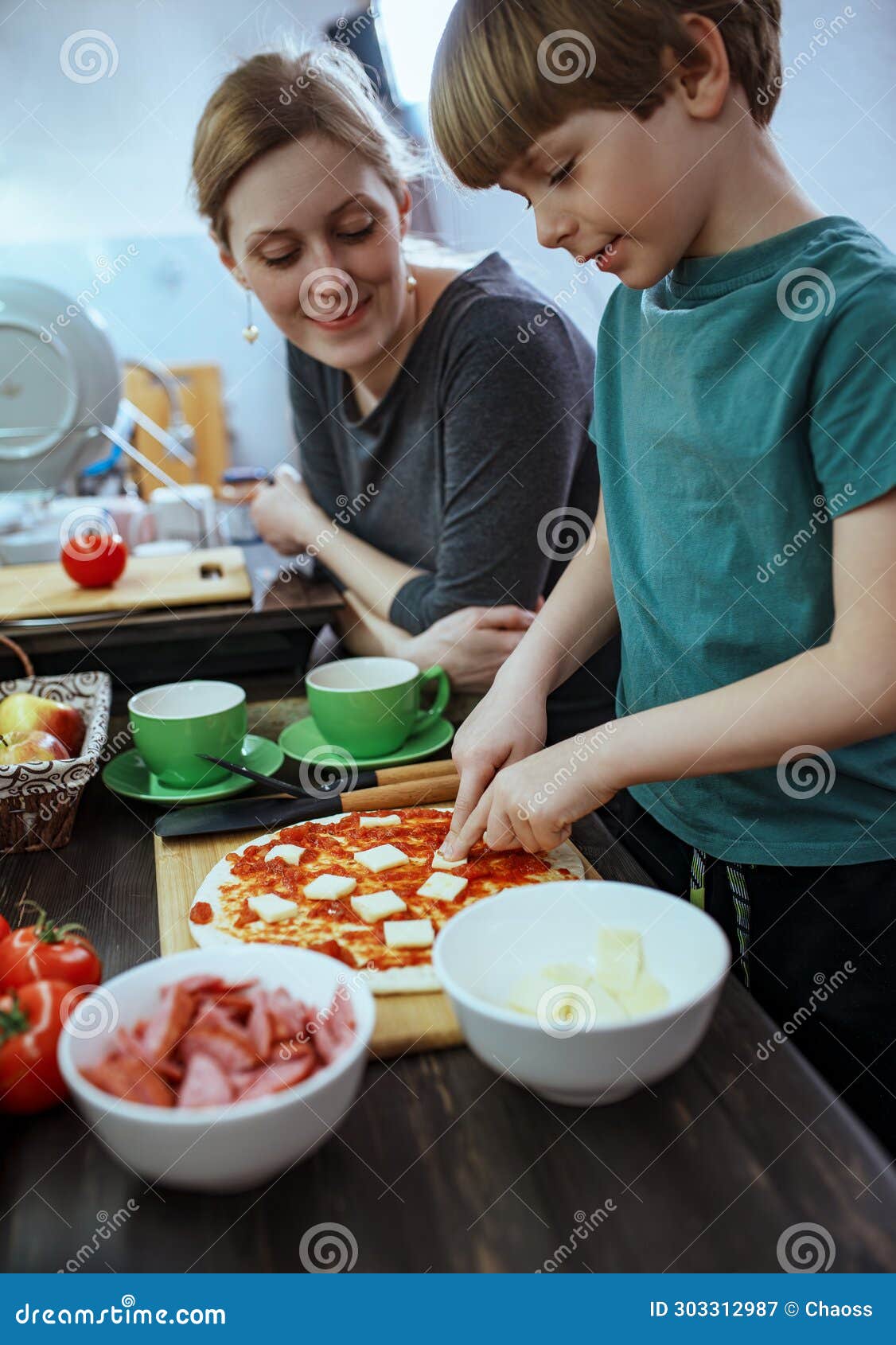 Mum Watching Her Son Make Pizza in Kitchen Stock Image - Image of ...