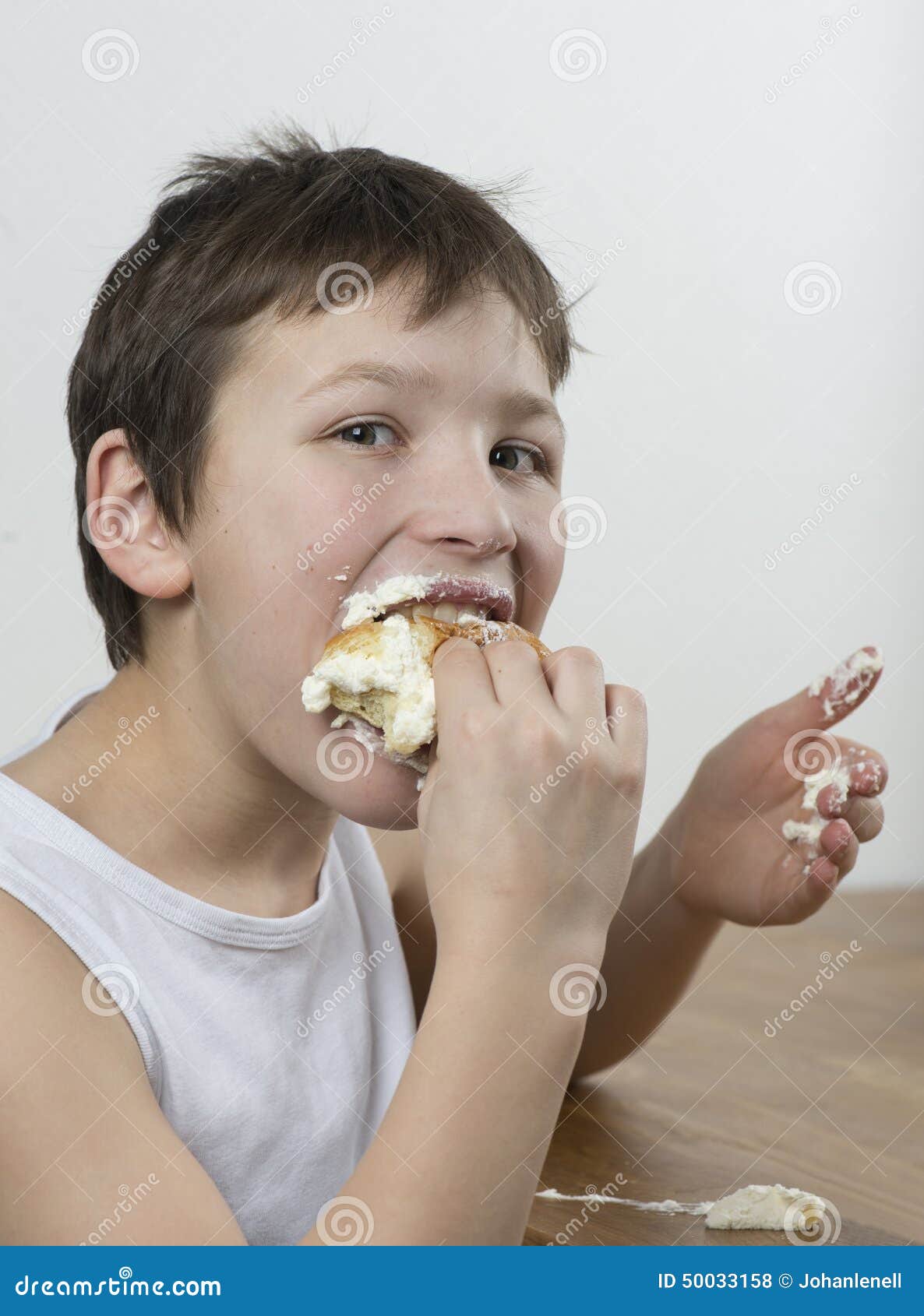 Munching on a cream bun stock photo. Image of dessert - 50033158