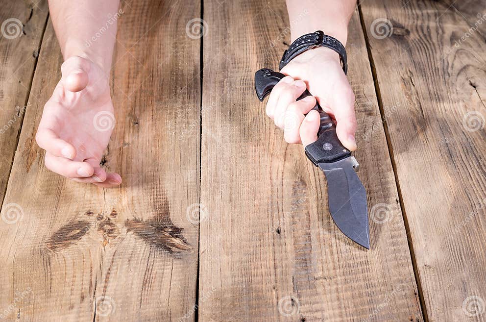 The Murder Weapon in the Hands. a Man Holds a Weapon Stock Photo ...