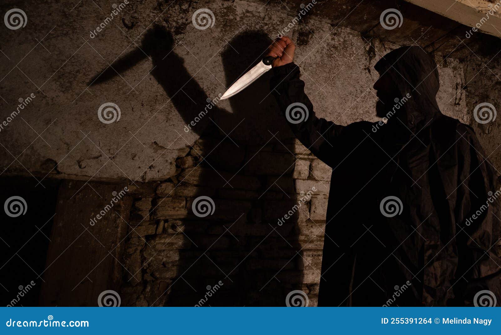 Murderer with Big Knife and Shadow Horror Scene Stock Photo - Image of ...