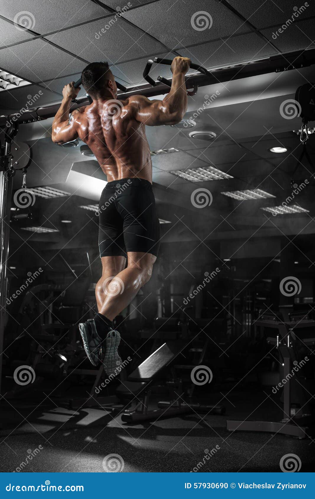Muscle Athlete Man in Gym Making Elevations Stock Photo - Image of ...