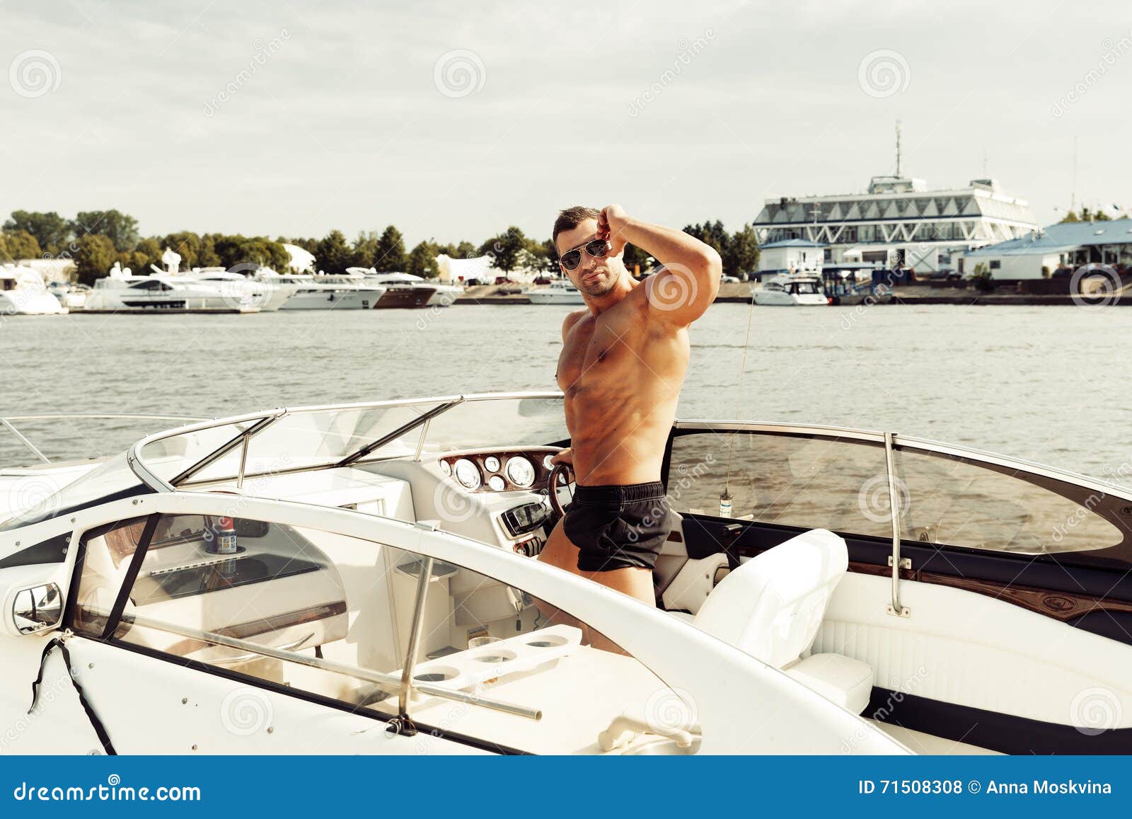 Muscle man on a boat stock photo. Image of boating, model - 71508308
